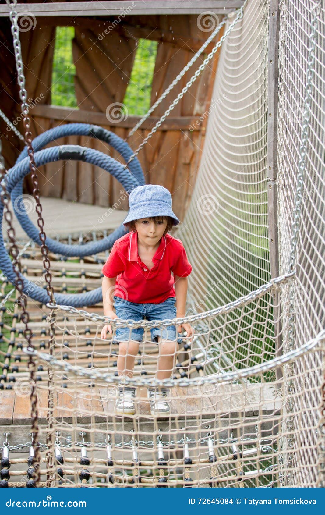 Cute Child, Boy, Climbing in a Rope Playground Structure Stock Photo ...