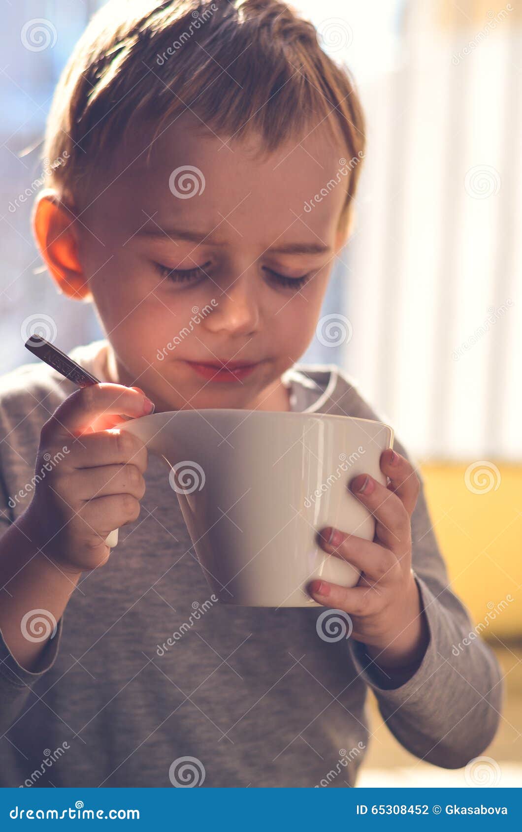 Cute child drinking tea stock photo. Image of hands, concept - 65308452