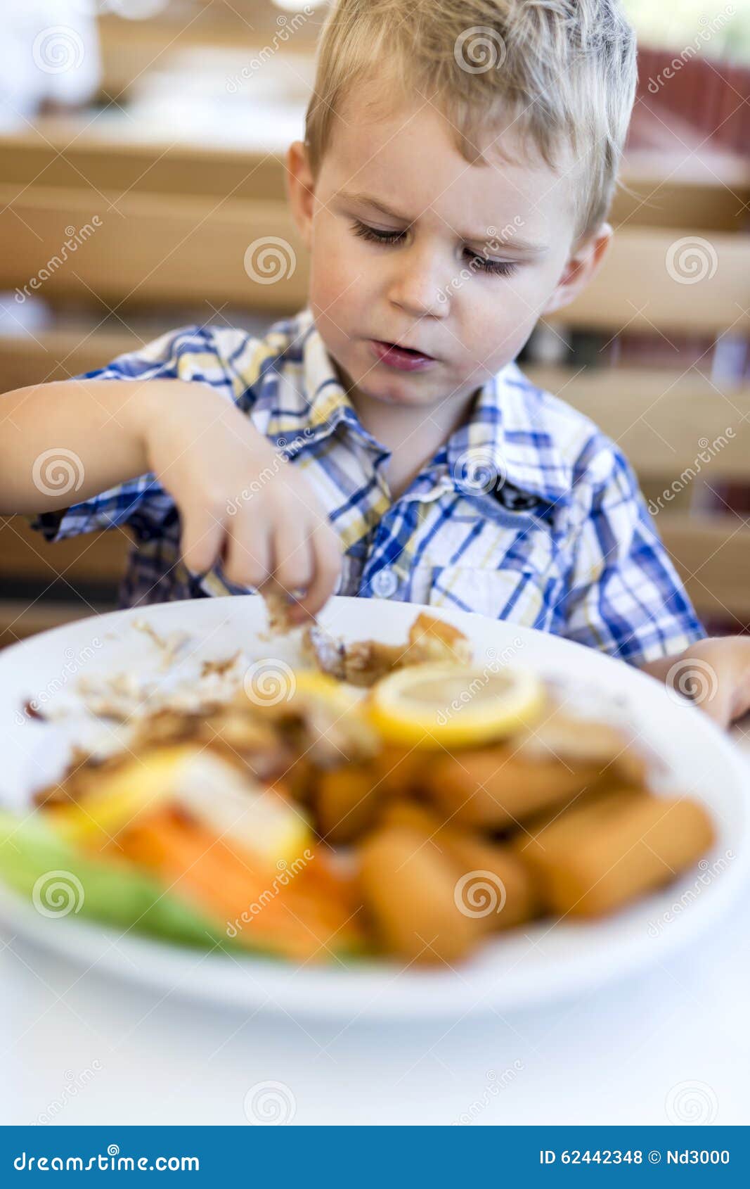 Cute child eating alone stock photo. Image of restaurant - 62442348