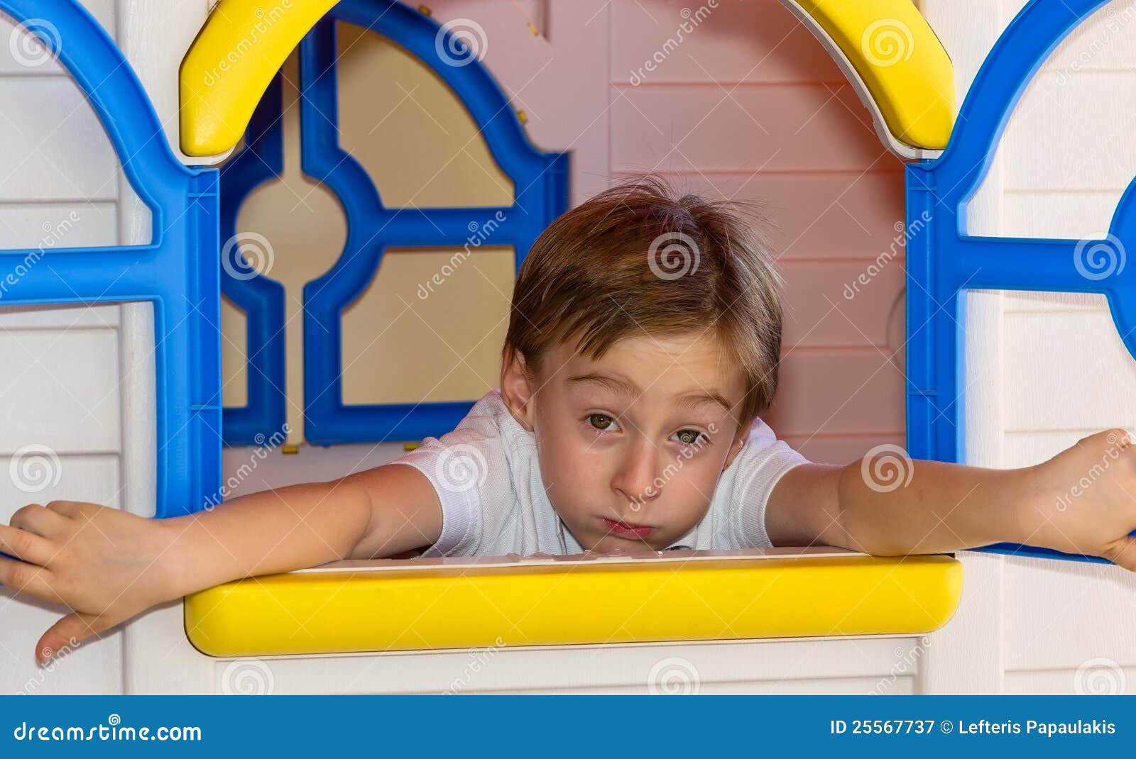 Cute Child Having a Bored Expression in Toy House Stock Image - Image ...