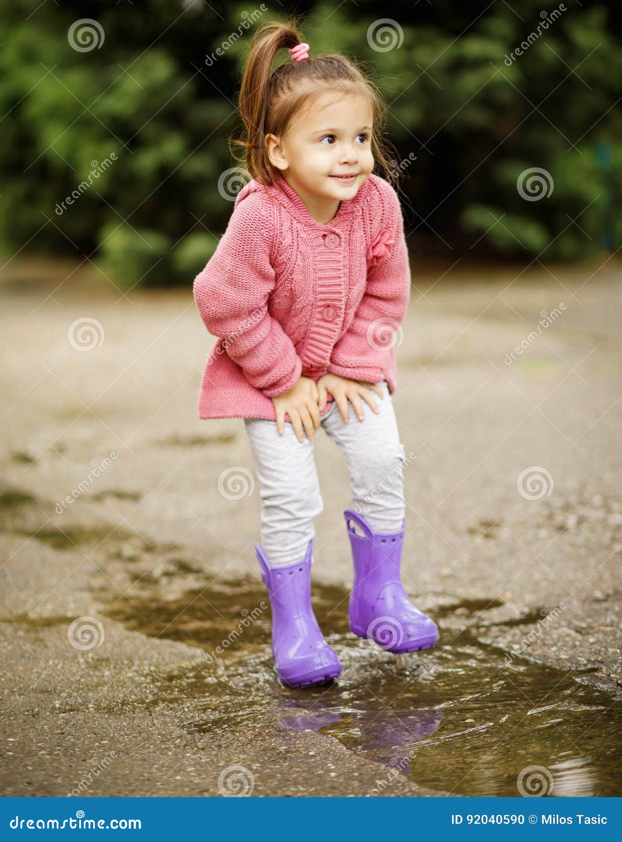 Cute Child Jumping in a Puddle of Water at the Summer or Autumn Stock ...