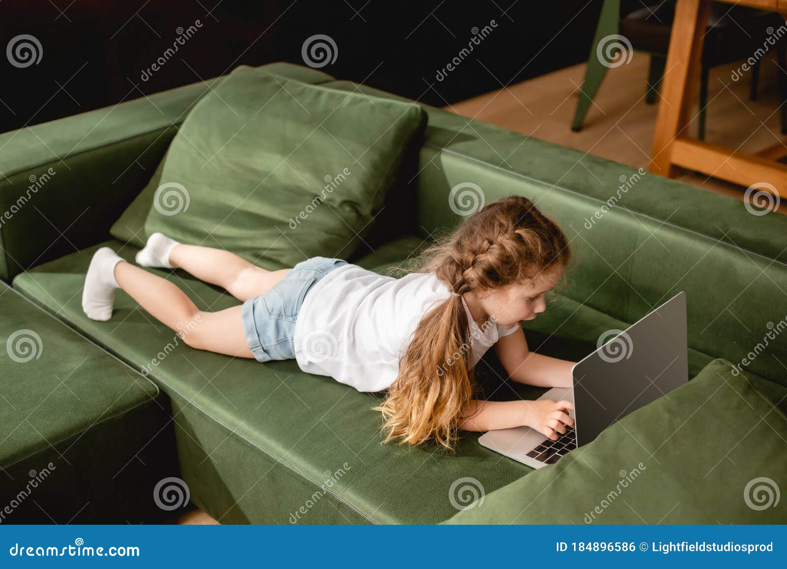 Child Lying on Sofa and Using Stock Photo - Image of preschooler ...