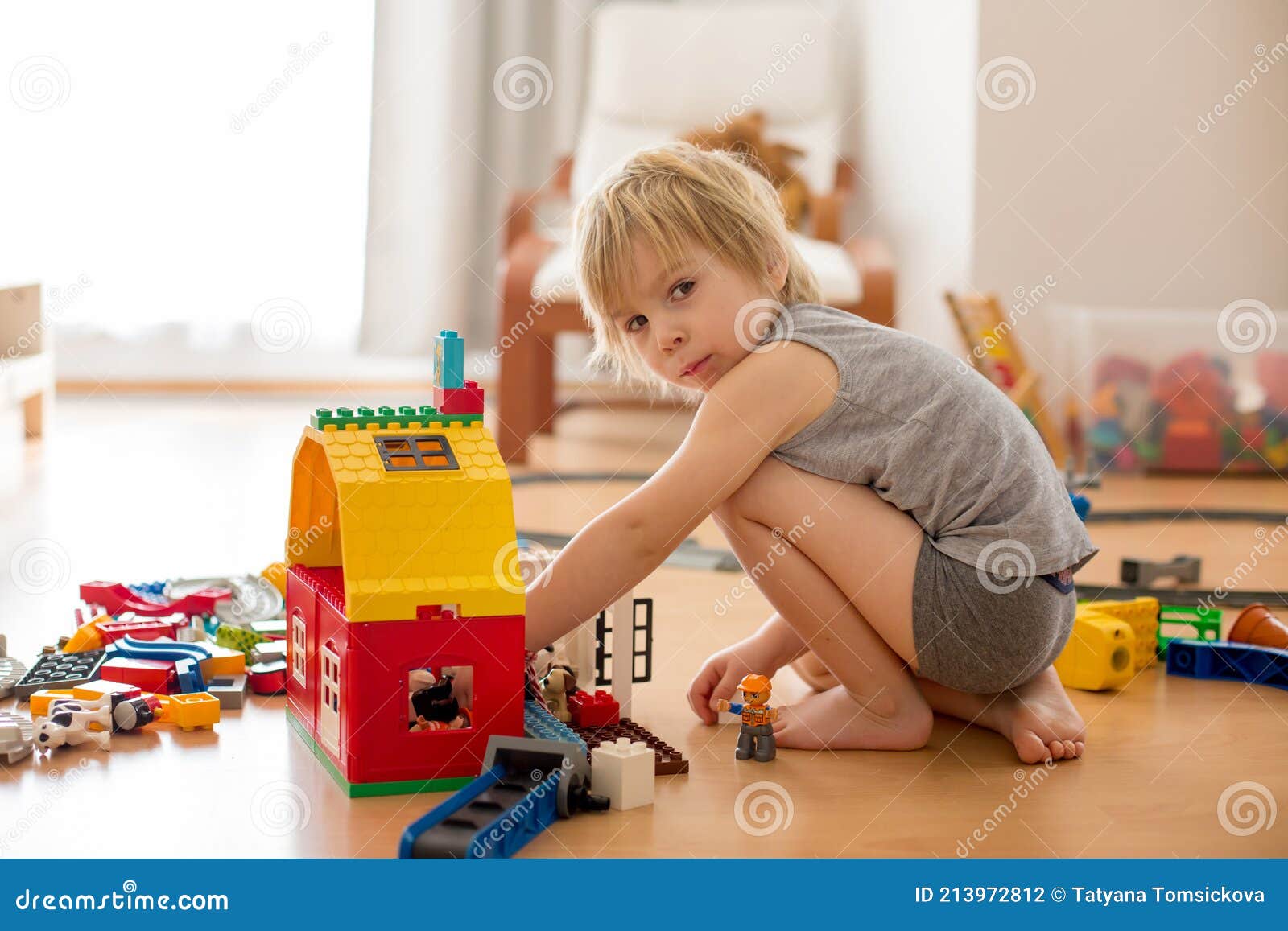 Cute Child, Playing with Colorful Toy Blocks. Little Boy Building House ... Cute Child, Playing with Colorful Toy Blocks. Little Boy Building House ...
