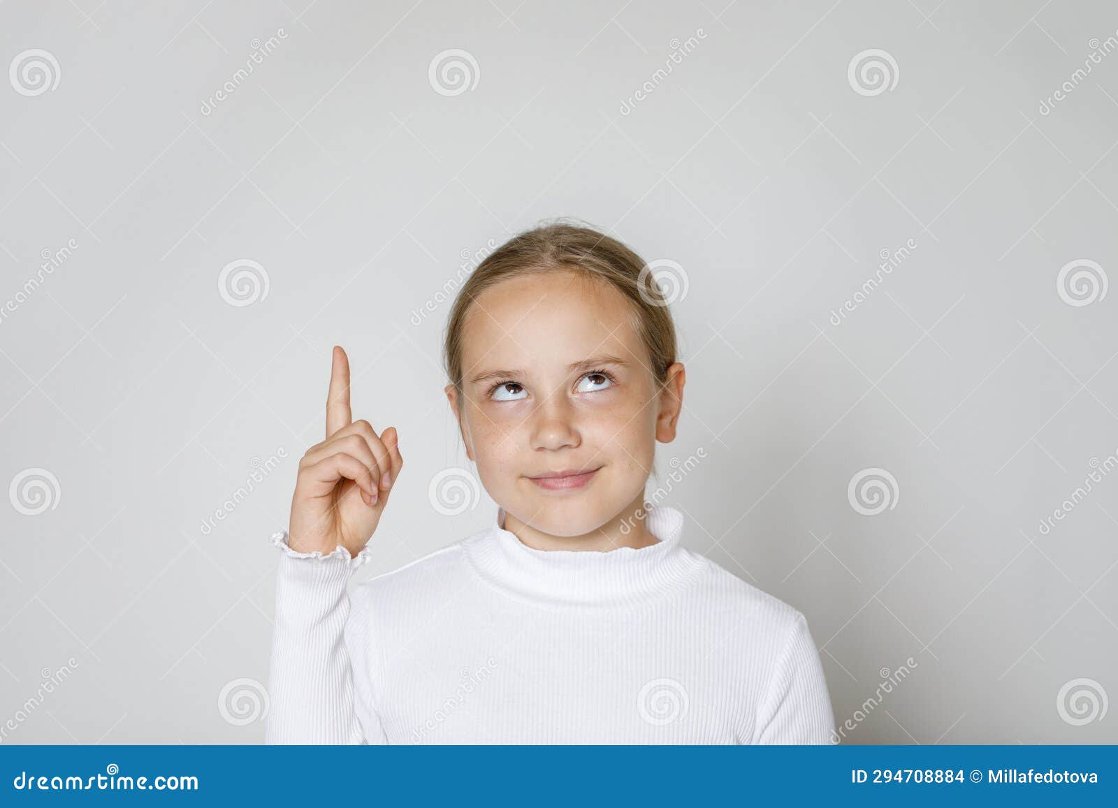 Cute Child Pointing Finger Up on White Studio Wall Background Stock ...