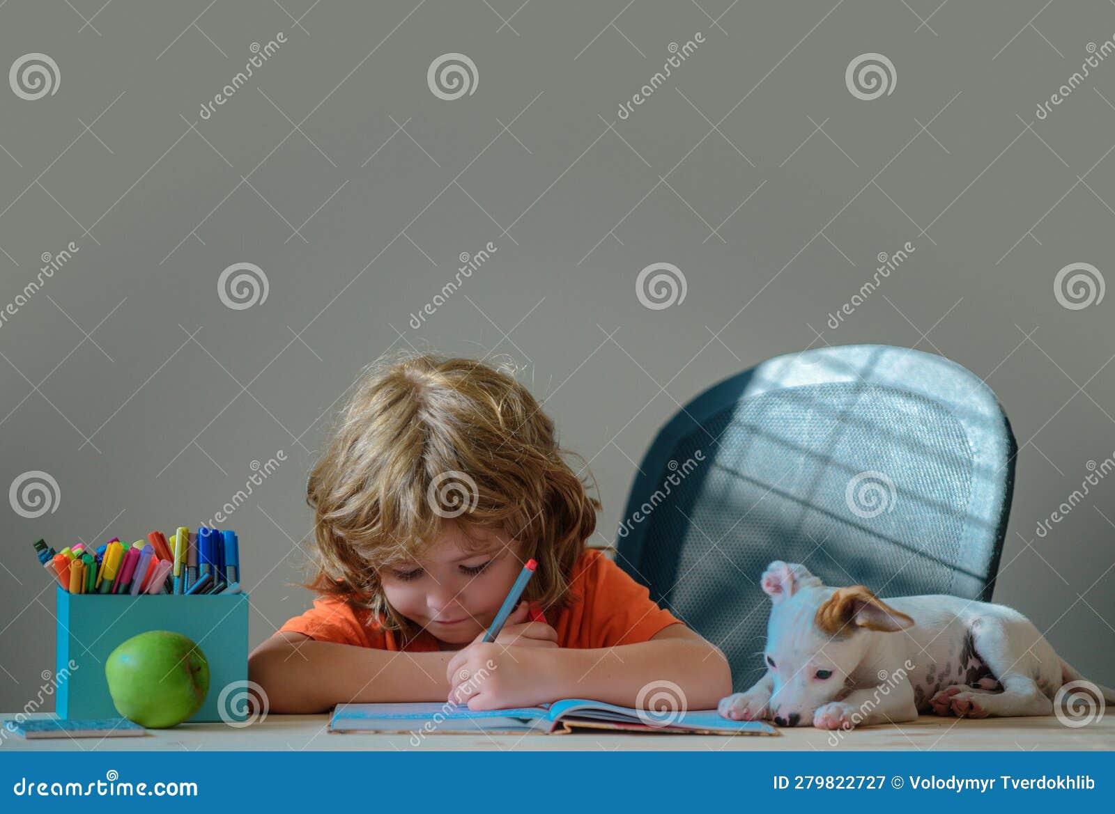 Cute Child with a Puppy Dog Studies and Learn at Home in Classroom ...
