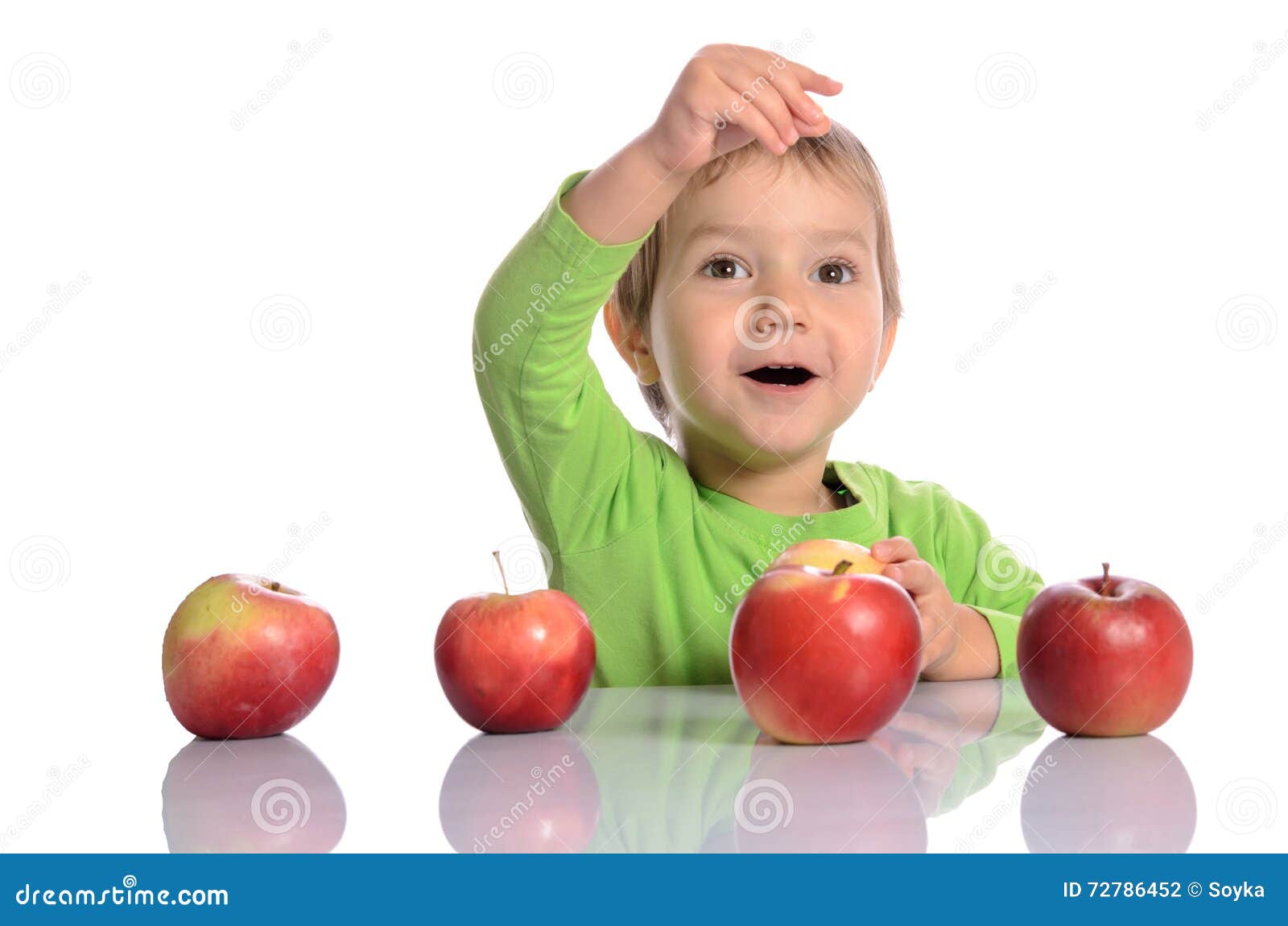 Cute child with red apples stock photo. Image of human - 72786452