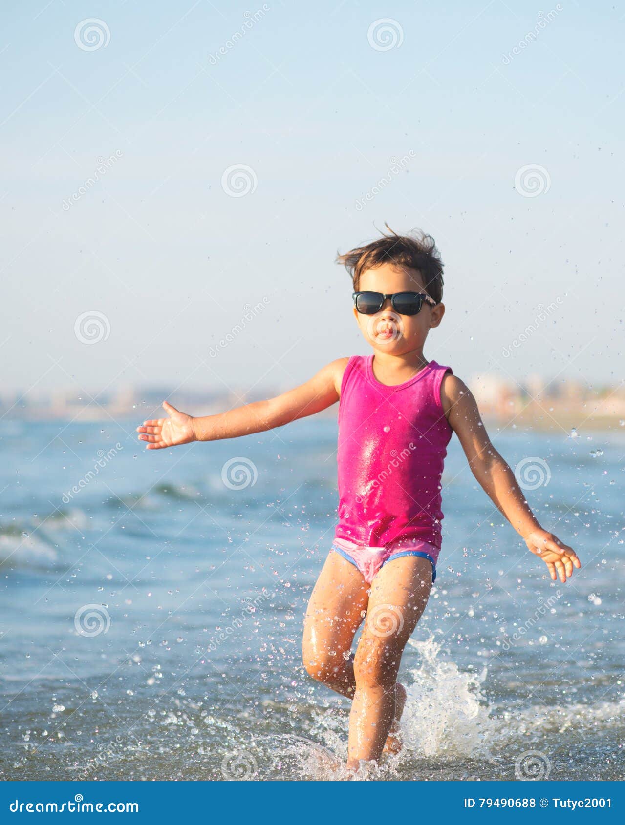 Cute Child Running in the Waves at Seaside Stock Photo - Image of ...