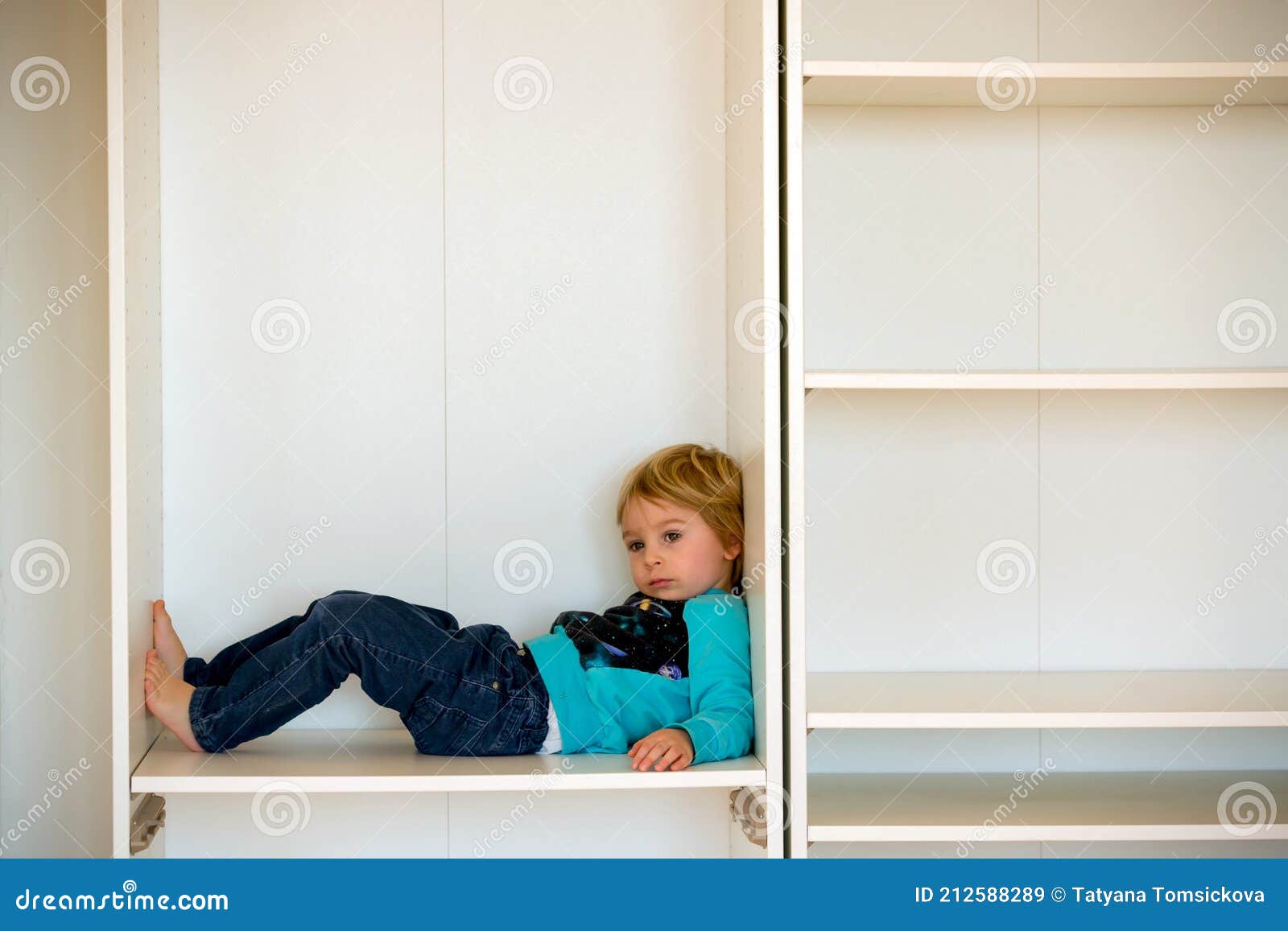 Cute Child, Sit in a White Box in Open Wardrope Stock Image - Image of ...
