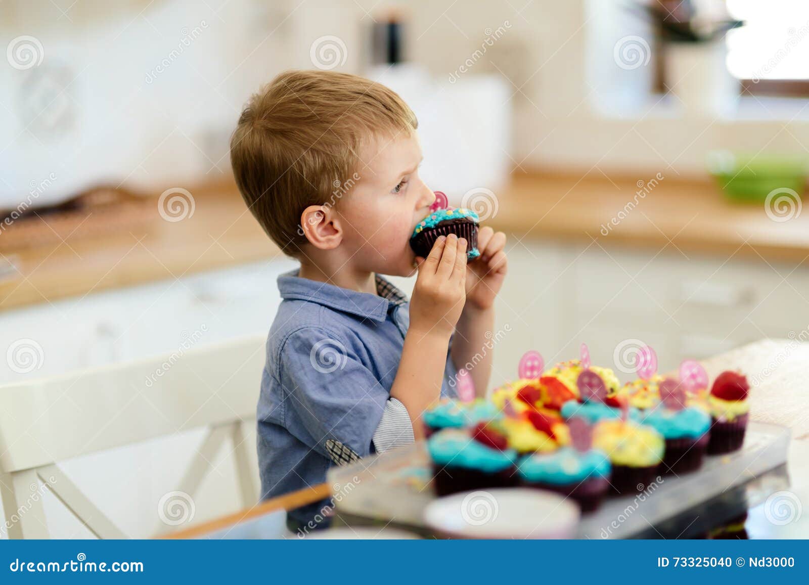 Cute child tasting cookies stock photo. Image of cook - 73325040