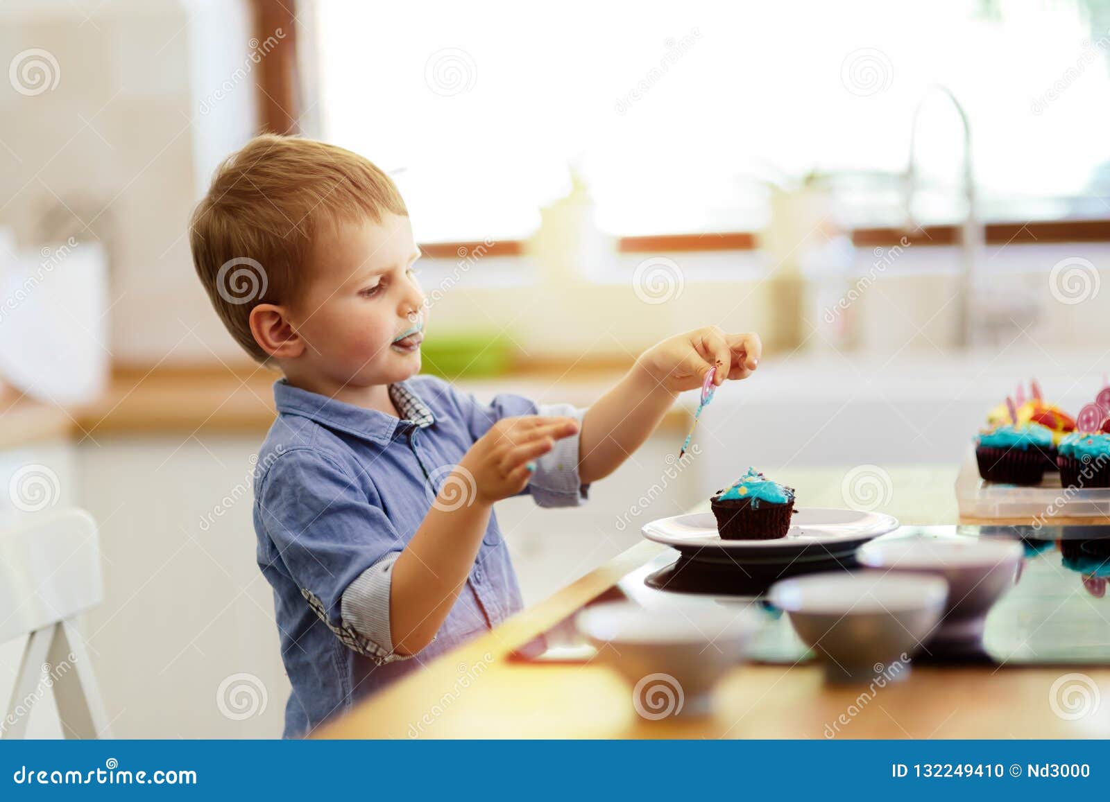 Cute child tasting cookies stock photo. Image of dough - 132249410