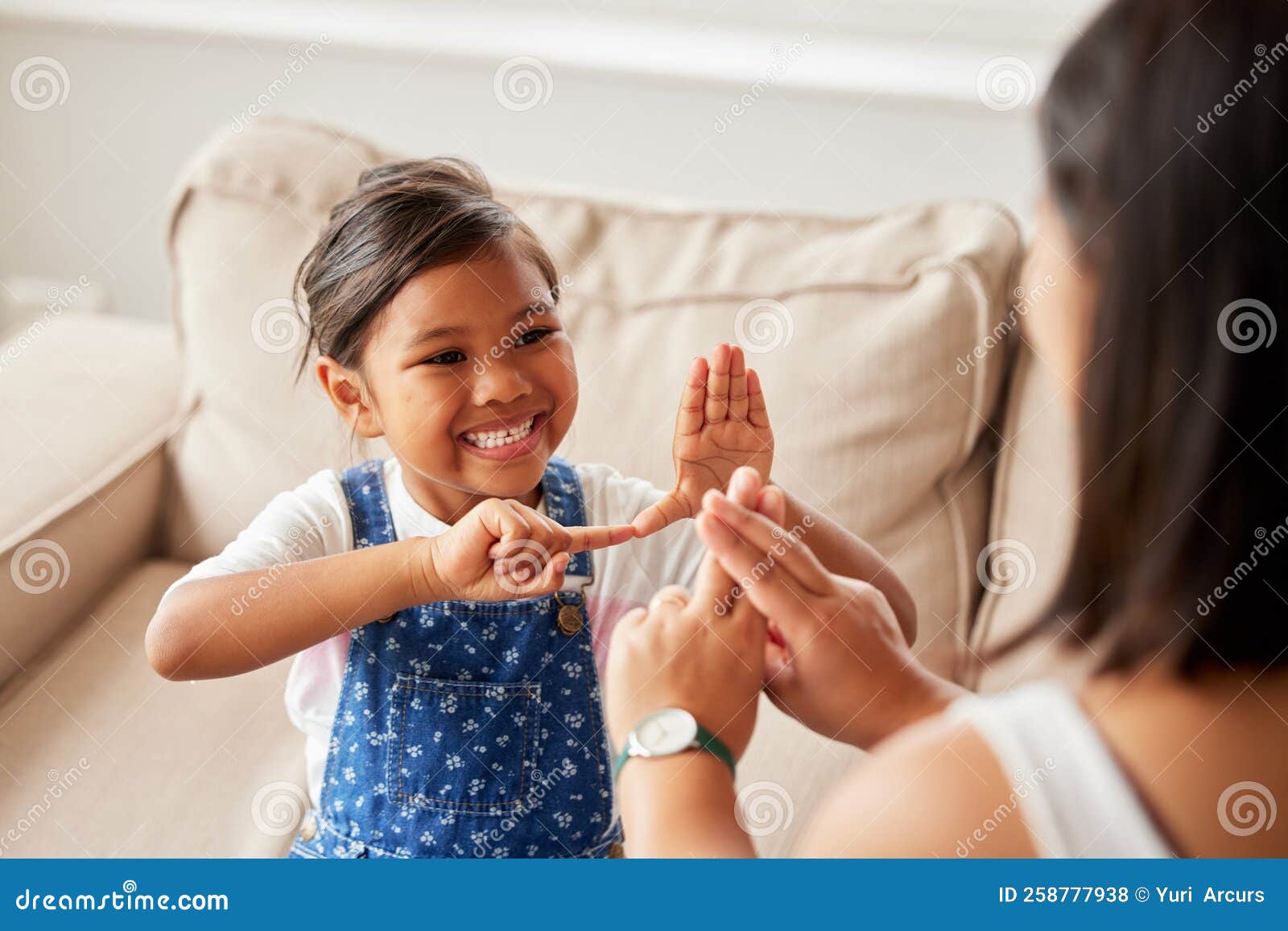 Cute Child Using Sign Language To Communicate and Talk with Her Mother ...
