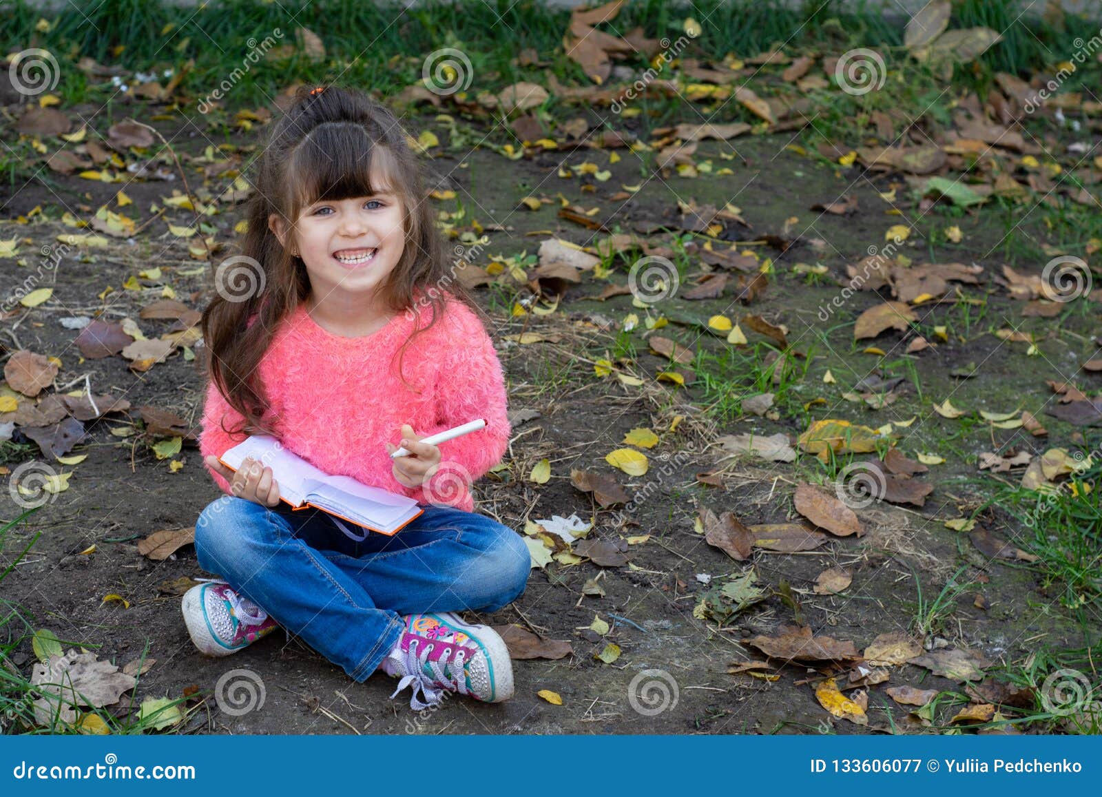 Cute Child Writing in Notebook Using Pen and Smiling. Four Years Old ...