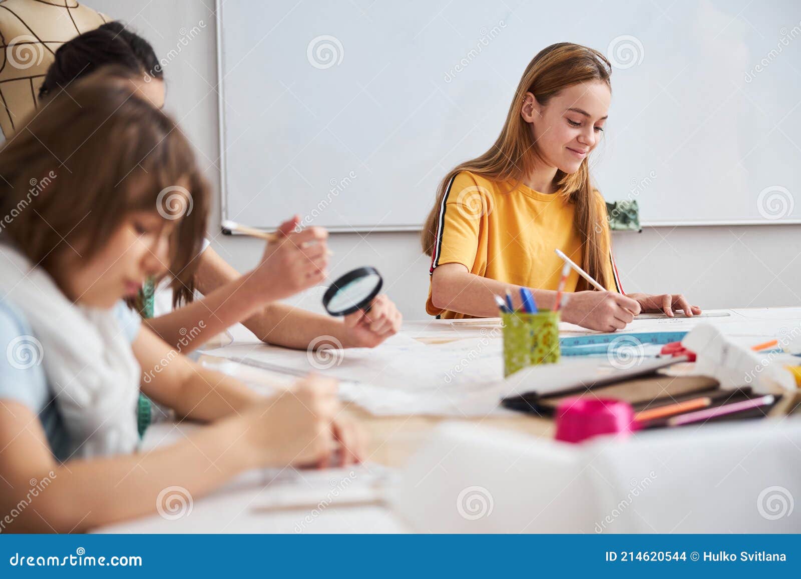 Cute Children Drawing Clothes Patterns in Sewing Workshop Stock Photo ...