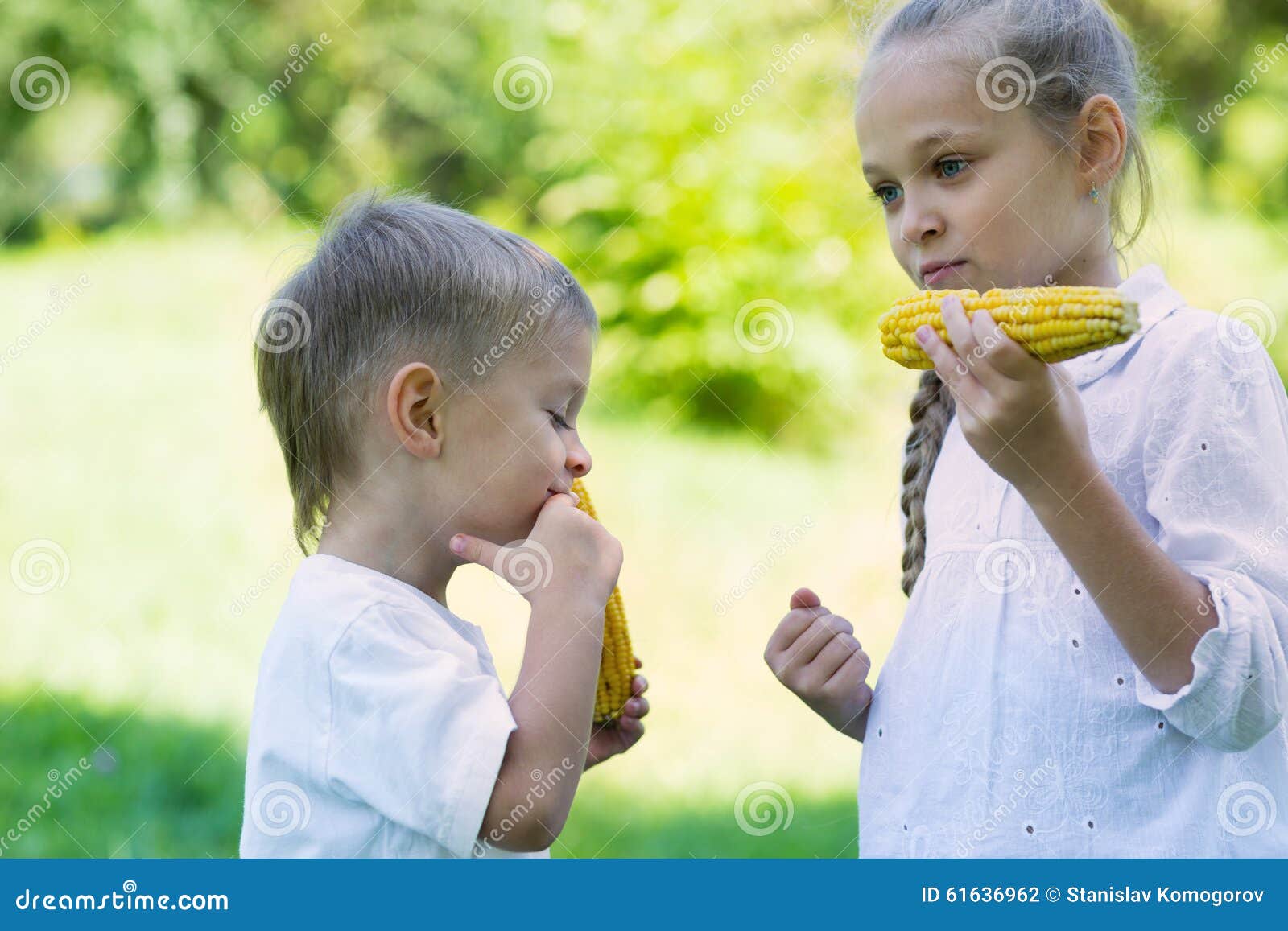Cute children eating corn stock photo. Image of boiled - 61636962