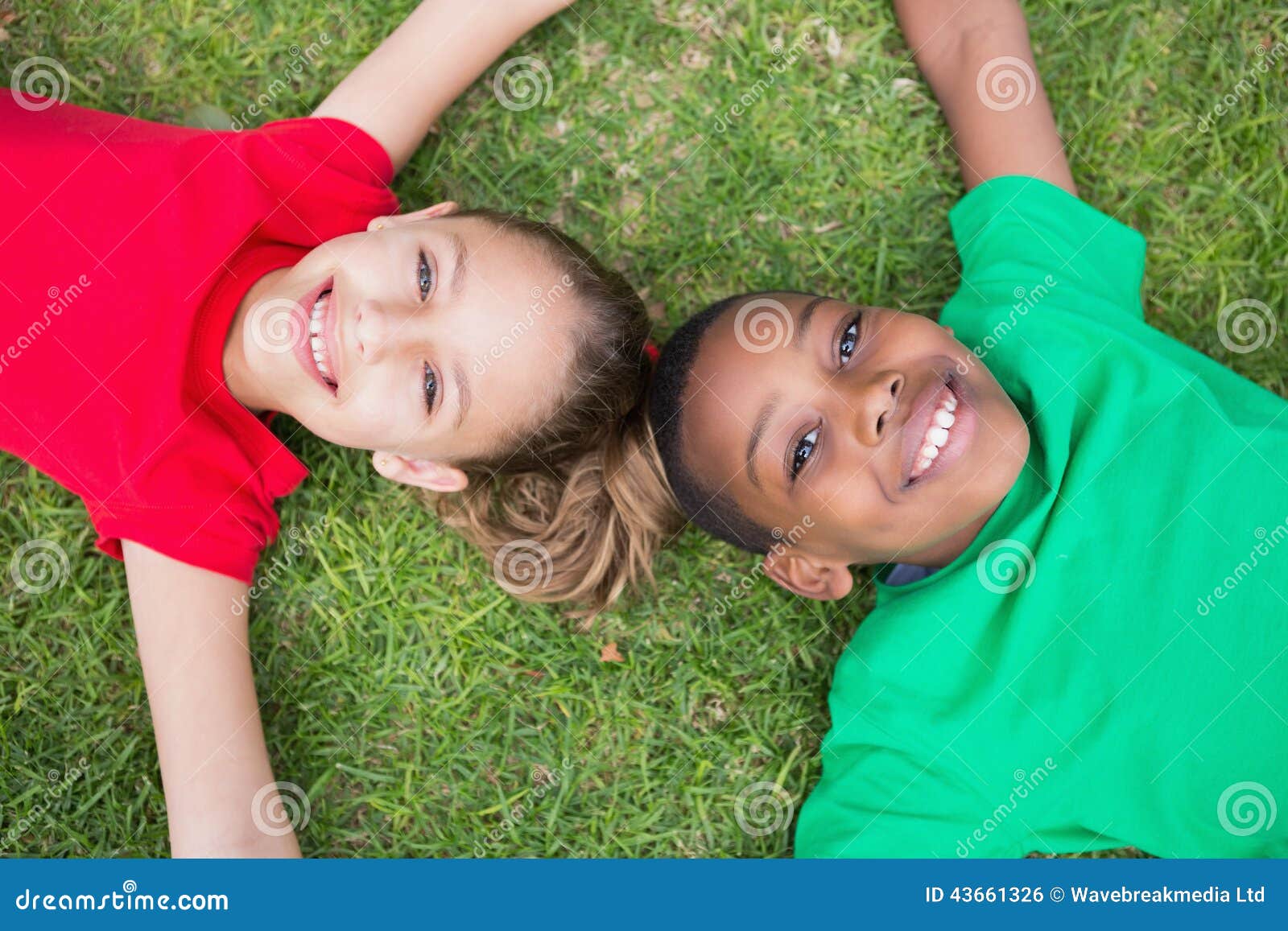 Cute Children Smiling at Camera Outside on the Grass Stock Photo ...