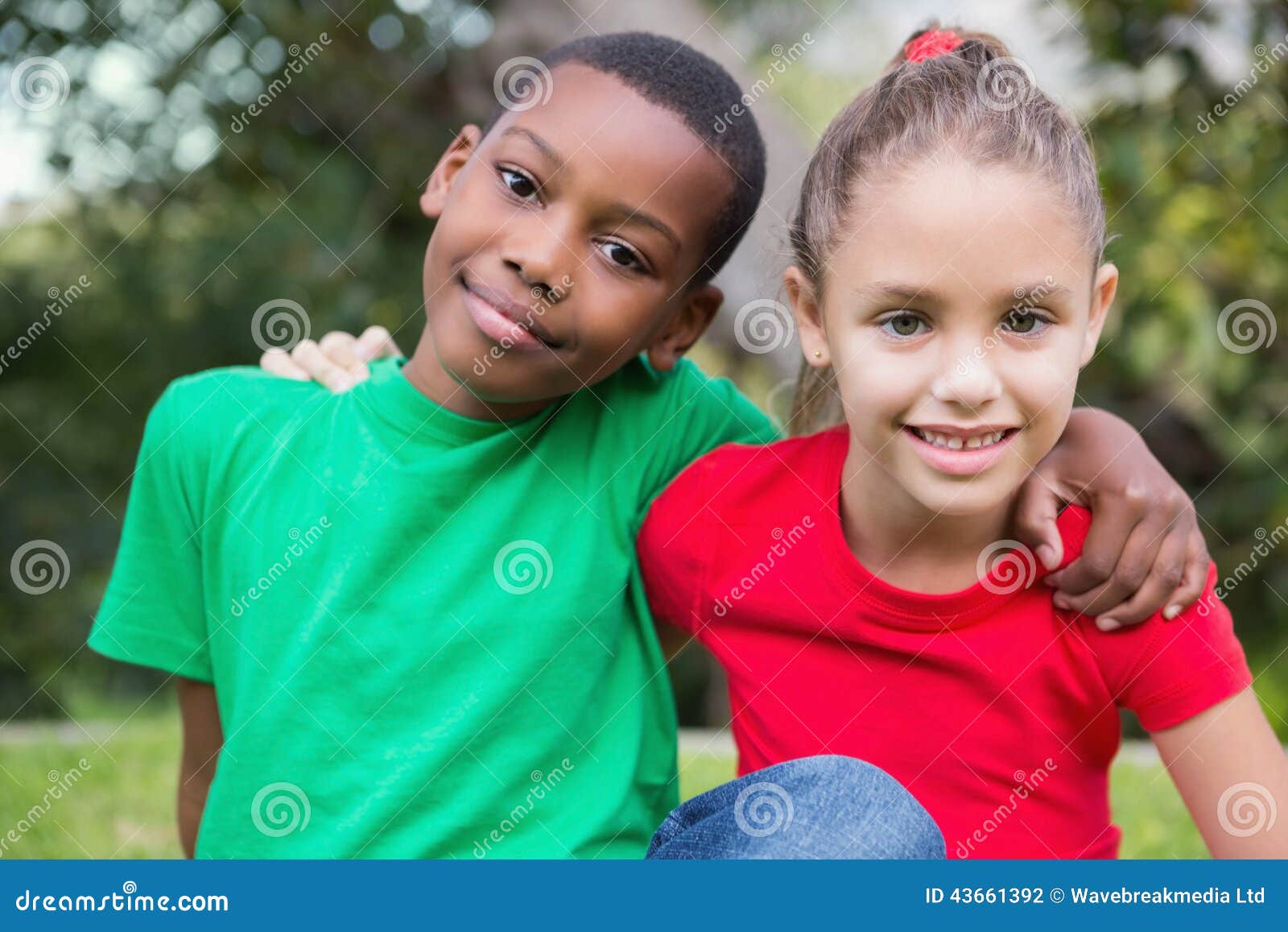Cute Children Smiling at Camera Outside on the Grass Stock Photo ...