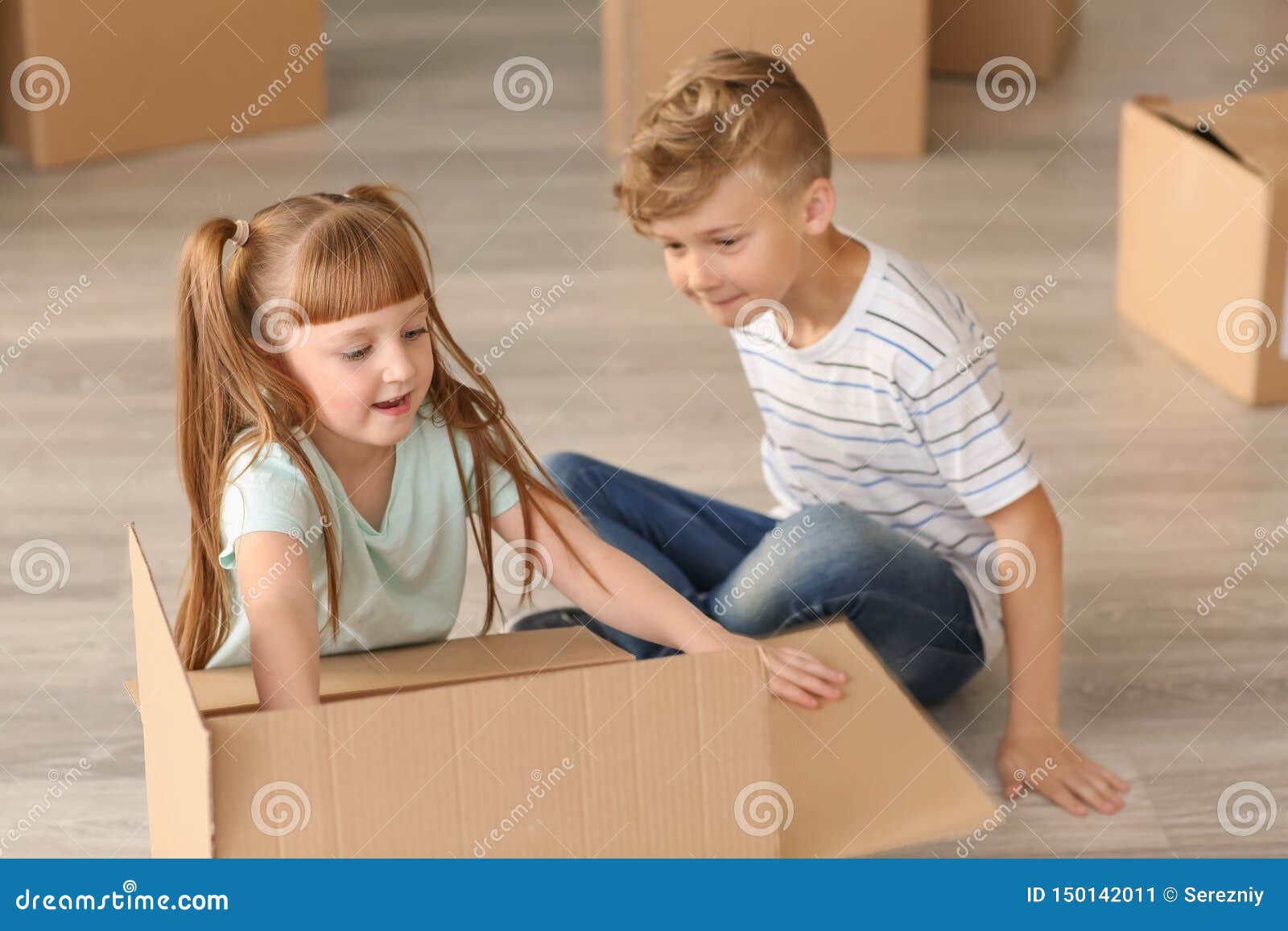 Cute Children Unpacking Box after Moving into New House Stock Image ...