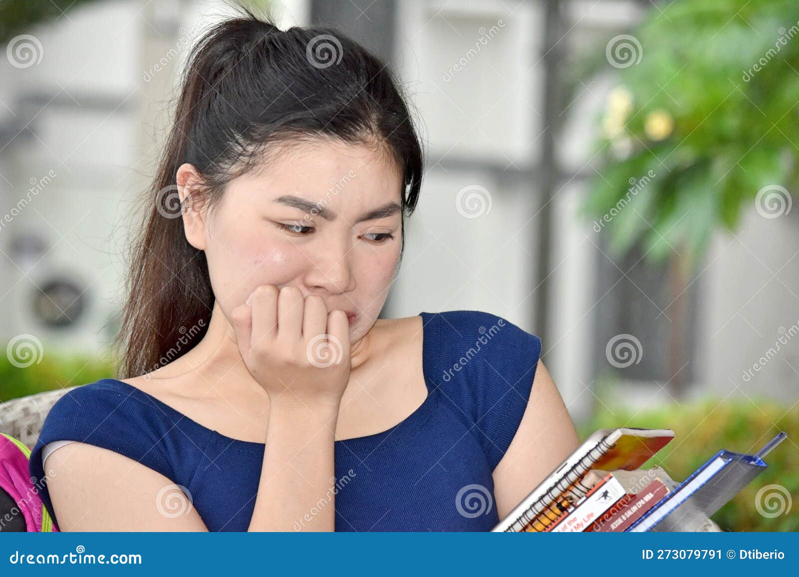 Cute Chinese Girl Student Decision Making with Books Stock Image ...