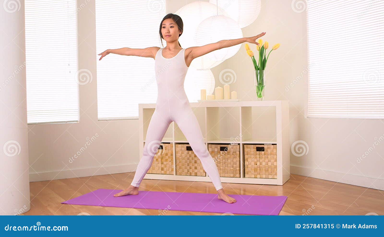 Cute Chinese Woman Doing Yoga Pose Extended Side Angle Stock Video