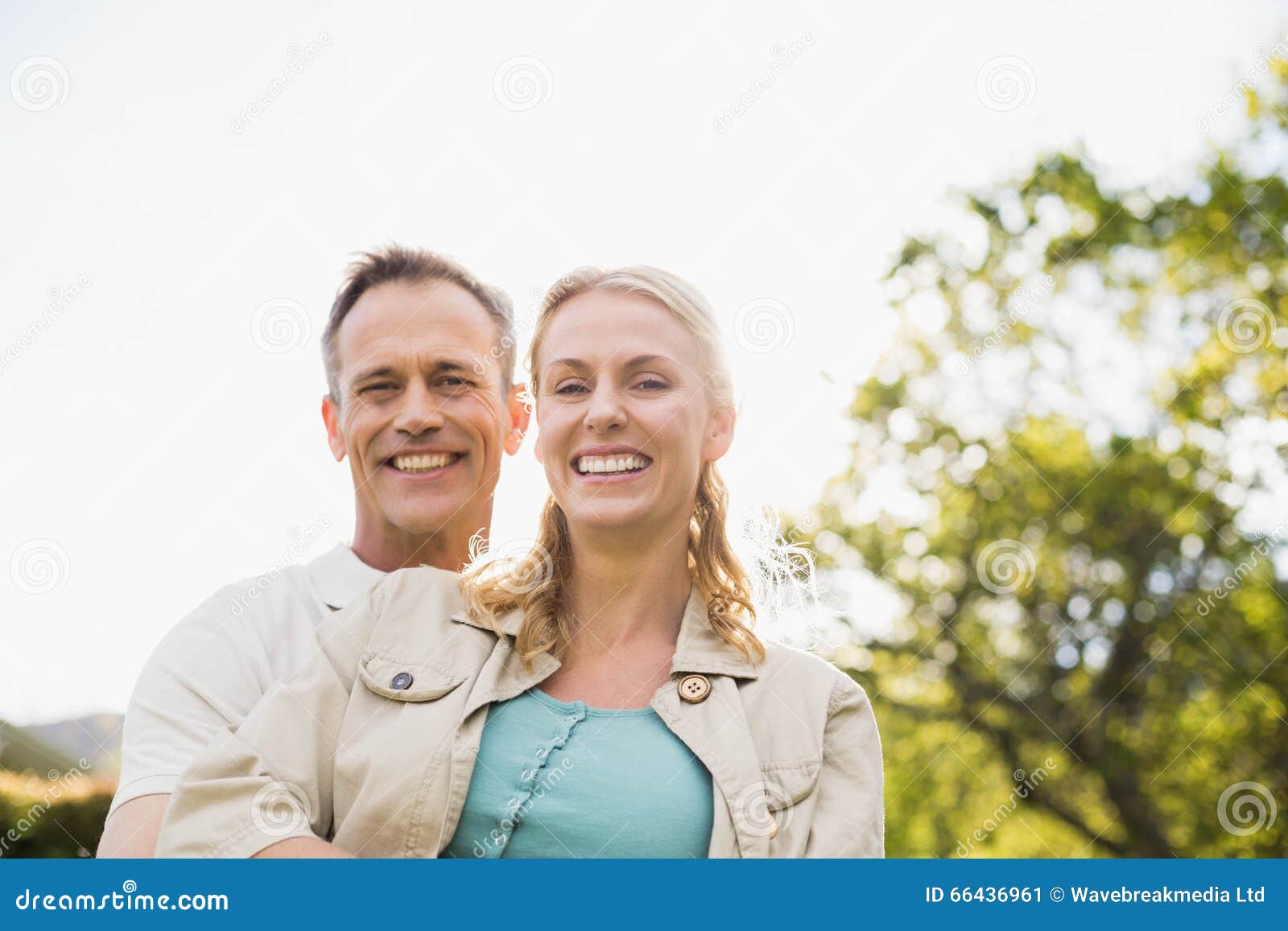 Cute Couple with Arms Around Each Other Stock Image - Image of grass ...