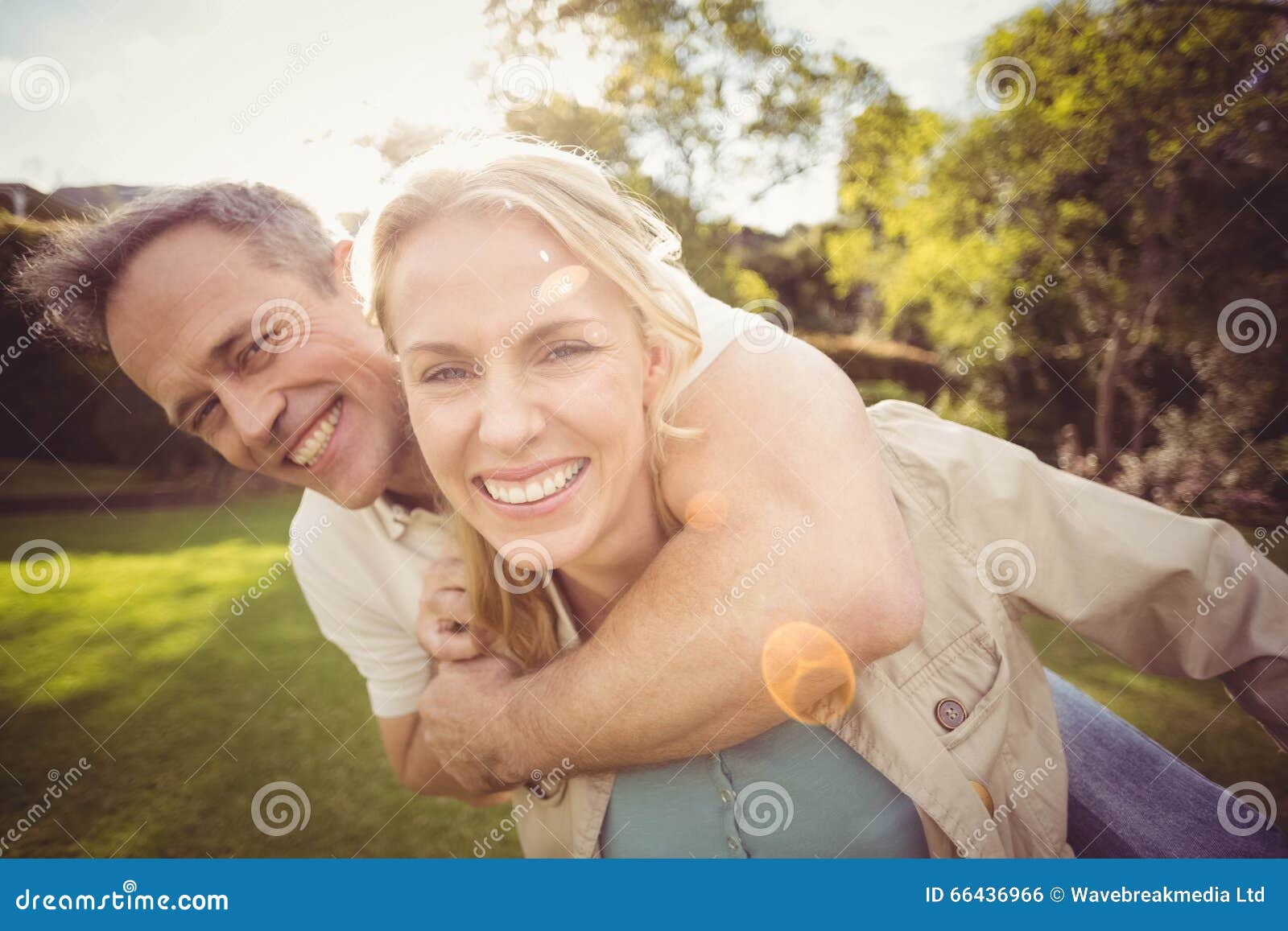 Cute Couple with Arms Around Each Other Stock Photo - Image of outdoors ...