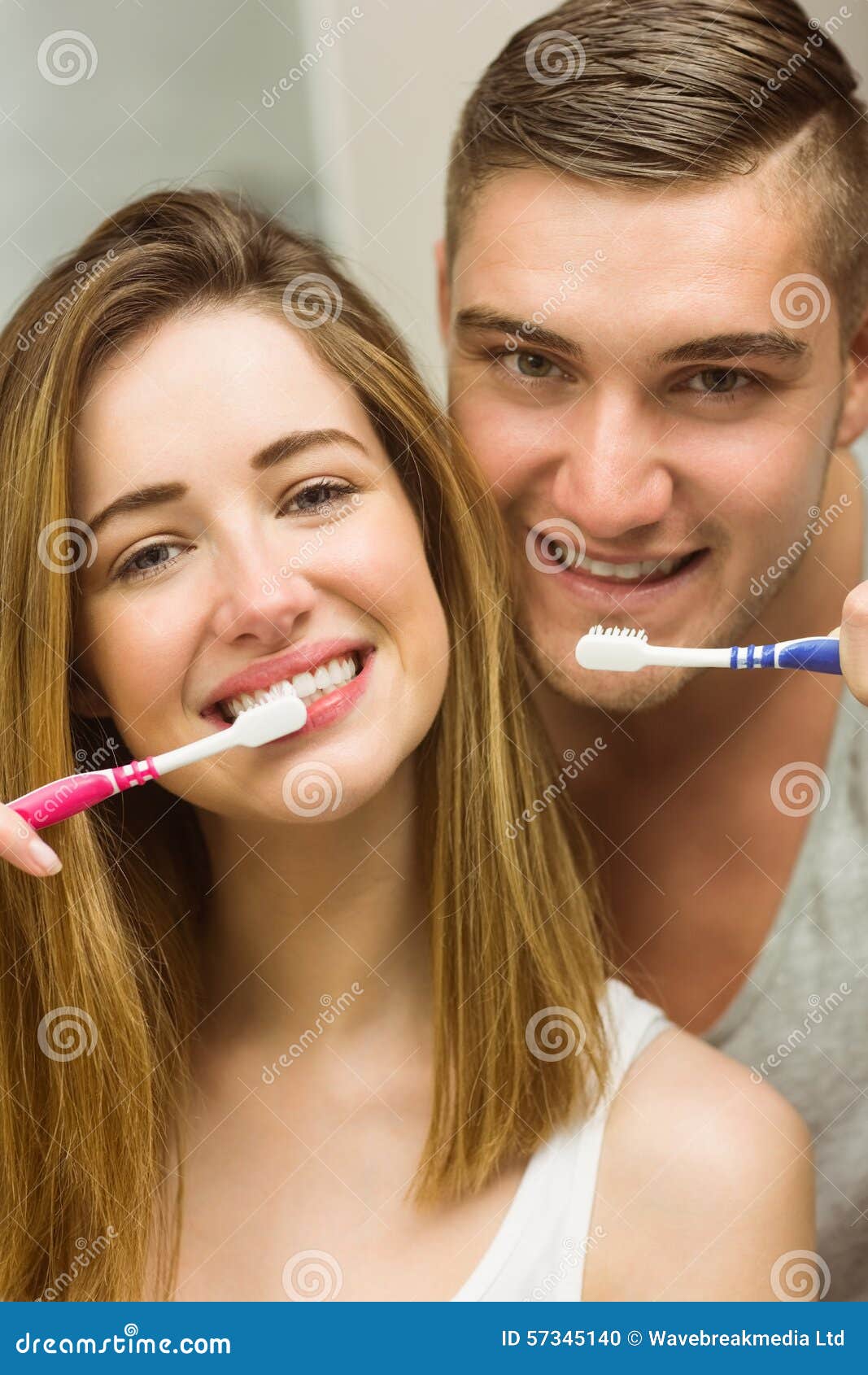 Cute Couple Brushing Their Teeth Stock Photo - Image of indoors, couple ...
