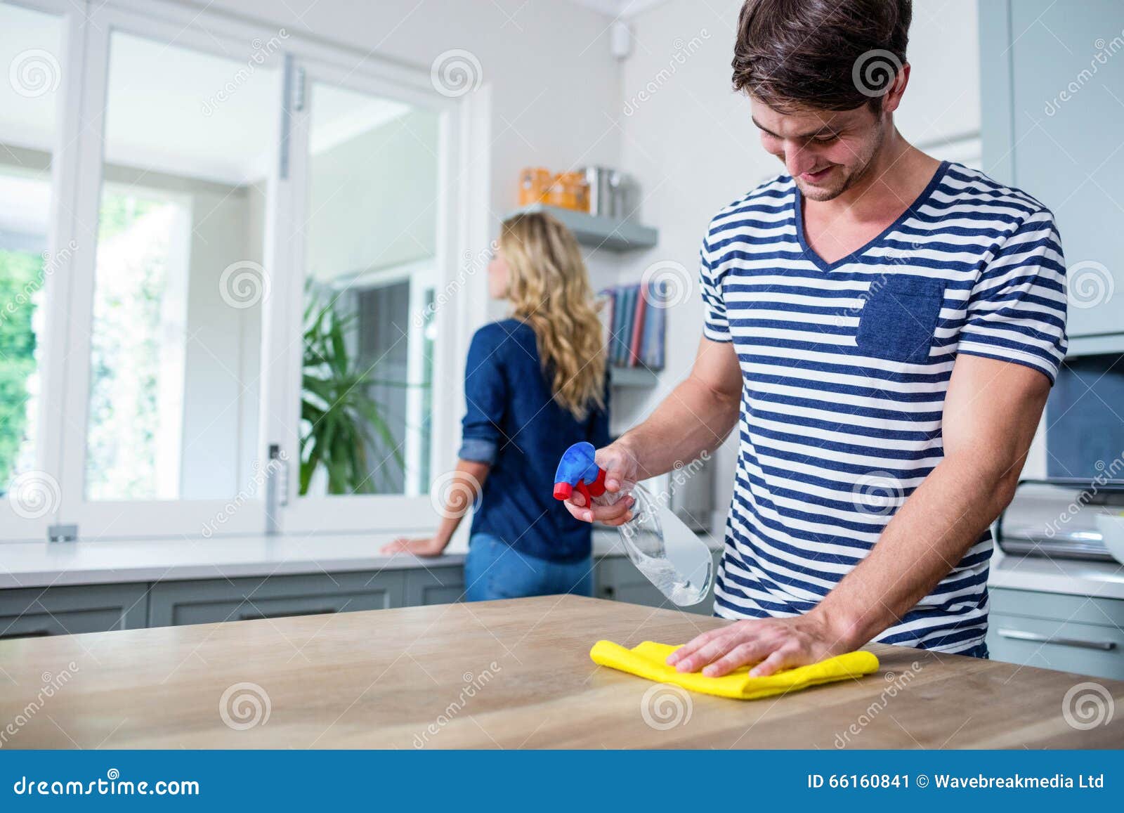 Cute couple cleaning up stock image. Image of adult, domicile - 66160841