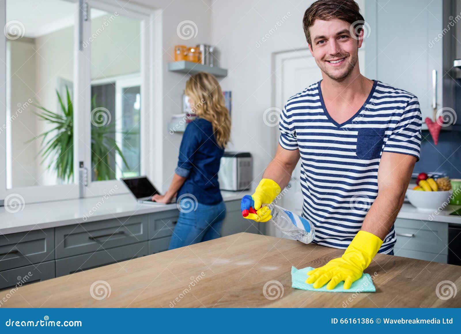 Cute couple cleaning up stock photo. Image of beautiful - 66161386