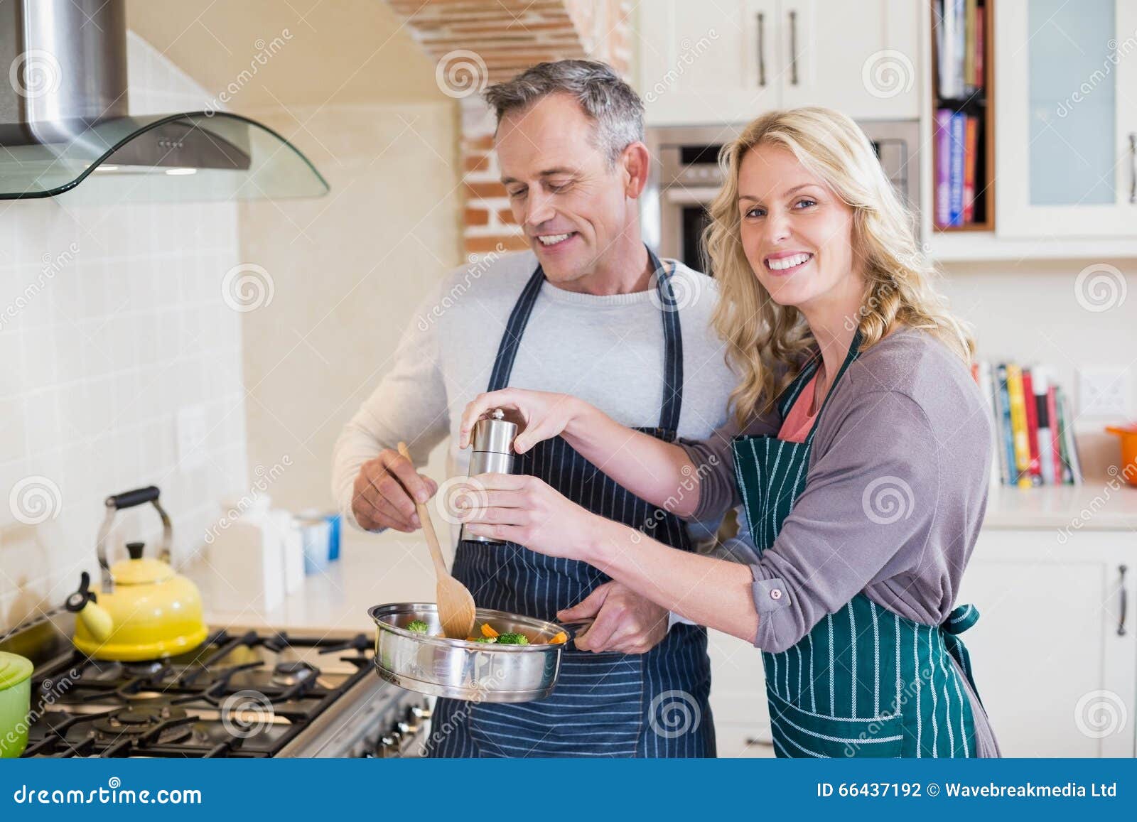 Cute couple cooking stock photo. Image of life, female - 66437192
