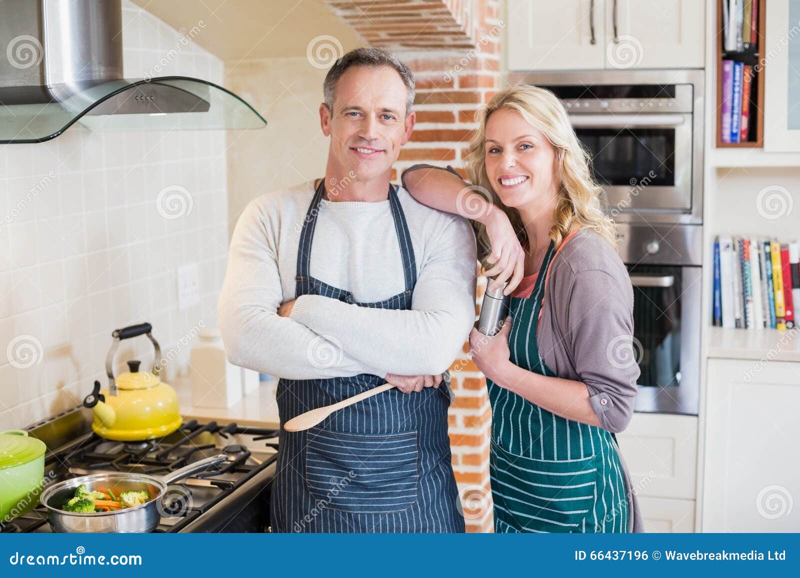Cute couple cooking stock photo. Image of domestic, enjoying - 66437196