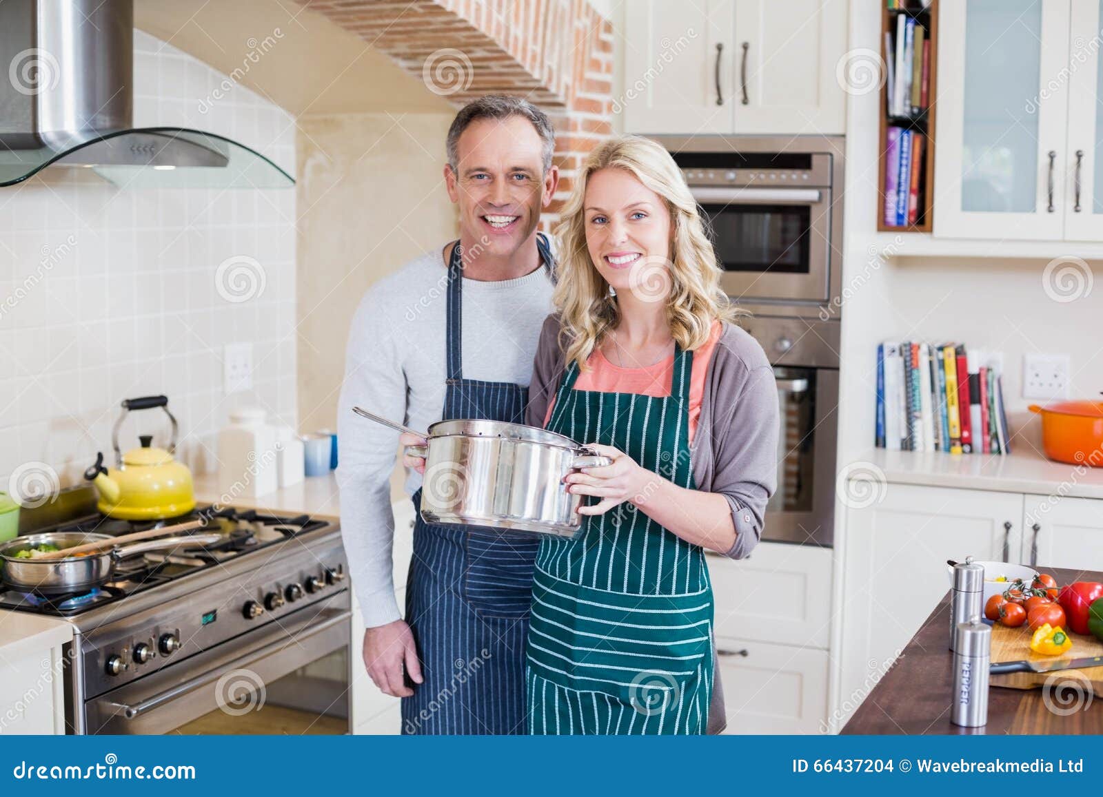 Cute couple cooking stock photo. Image of home, indoors - 66437204