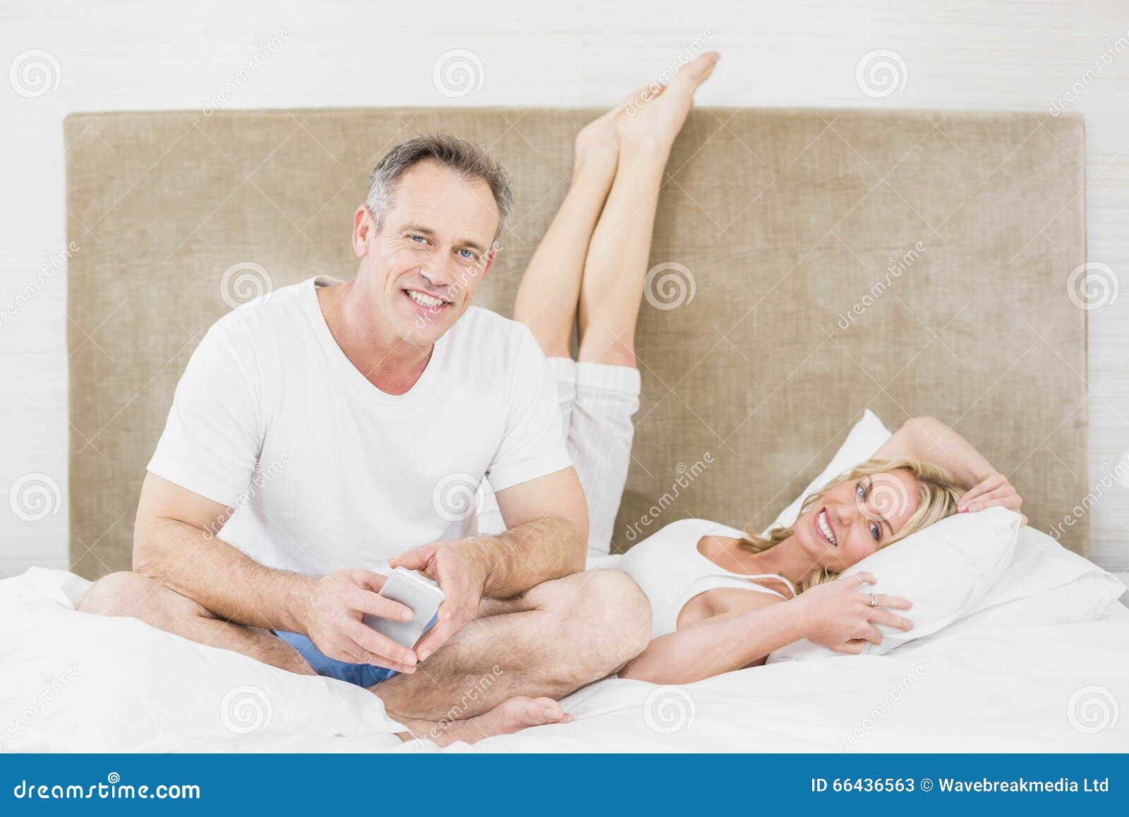 Cute Couple Cuddling in Bed Stock Image - Image of adult, clothing ...