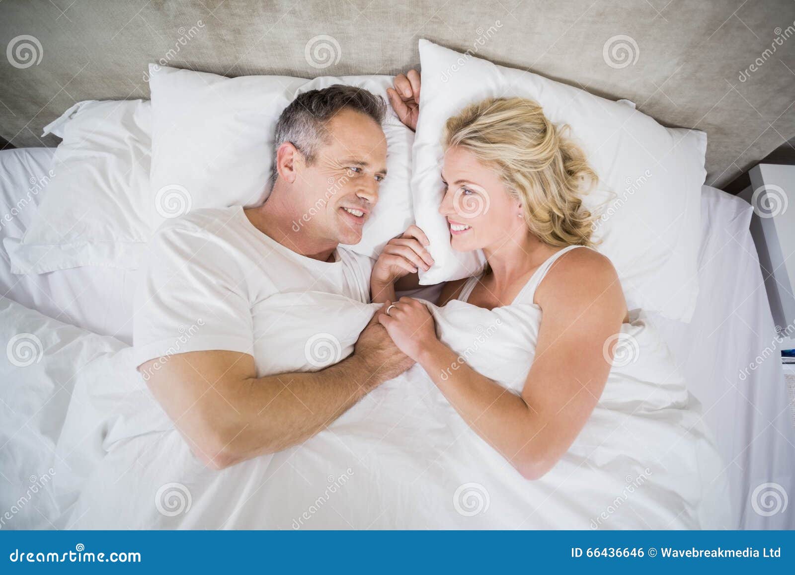 Cute Couple Cuddling in Bed Stock Photo - Image of handsome, abode ...