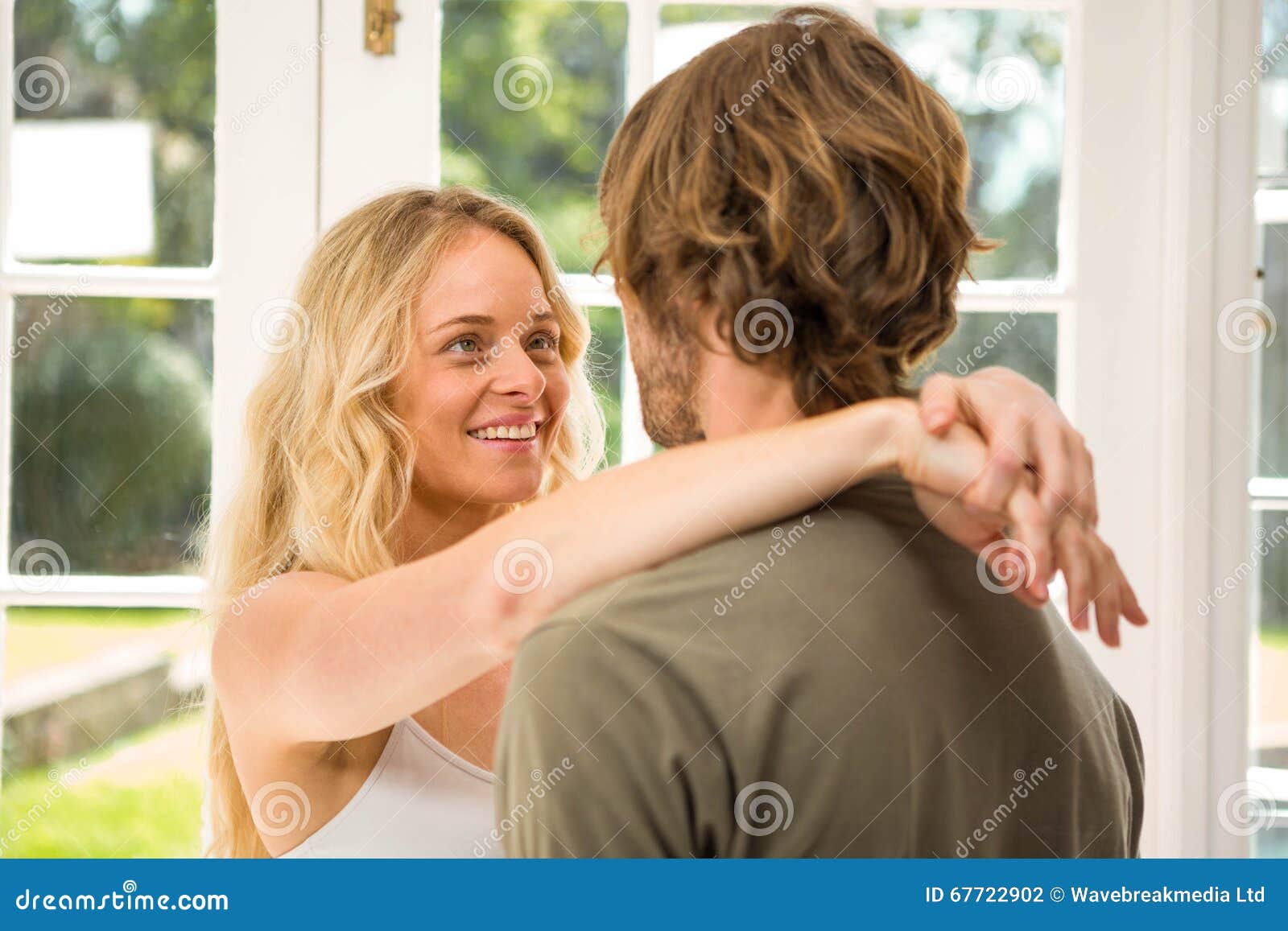 Cute couple cuddling stock photo. Image of domicile, abode - 67722902