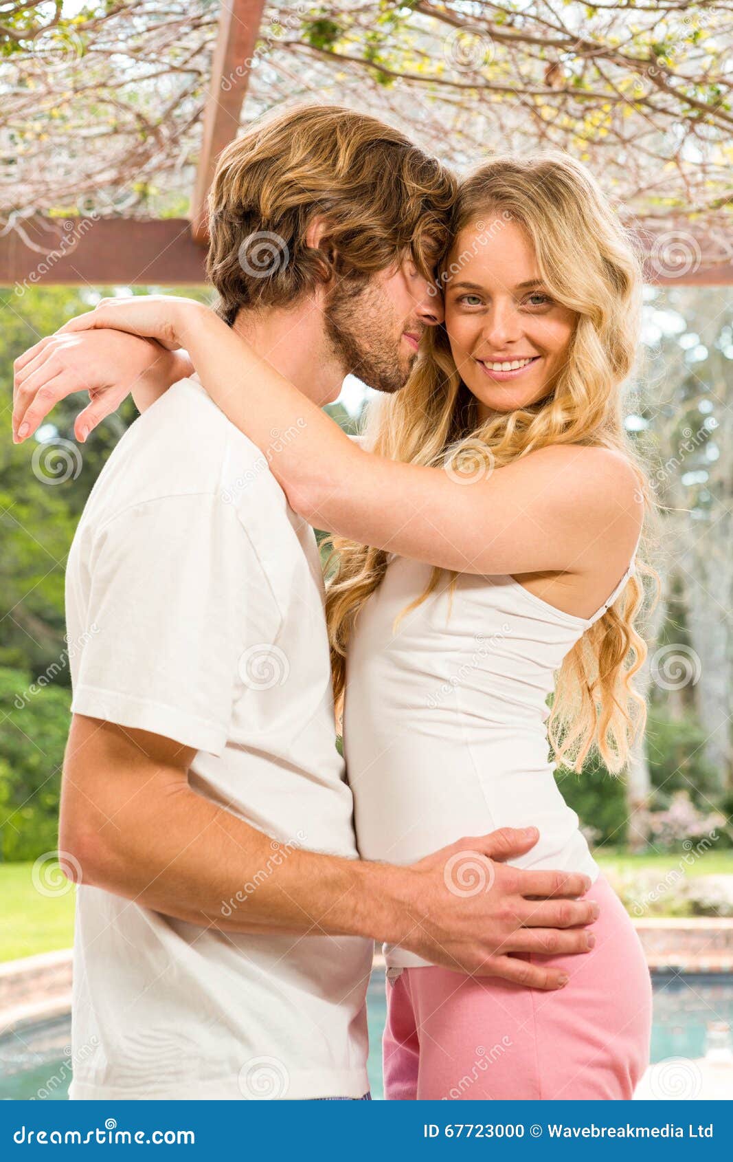Cute couple cuddling stock photo. Image of domicile, blonde - 67723000