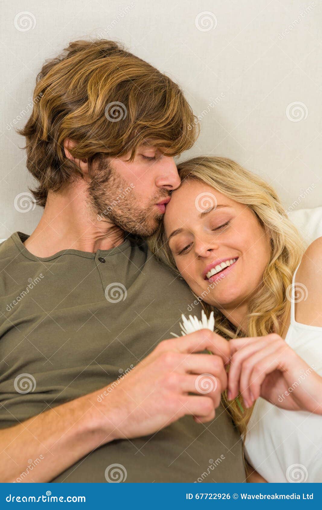Cute Couple Cuddling on Their Bed Stock Photo - Image of house ...