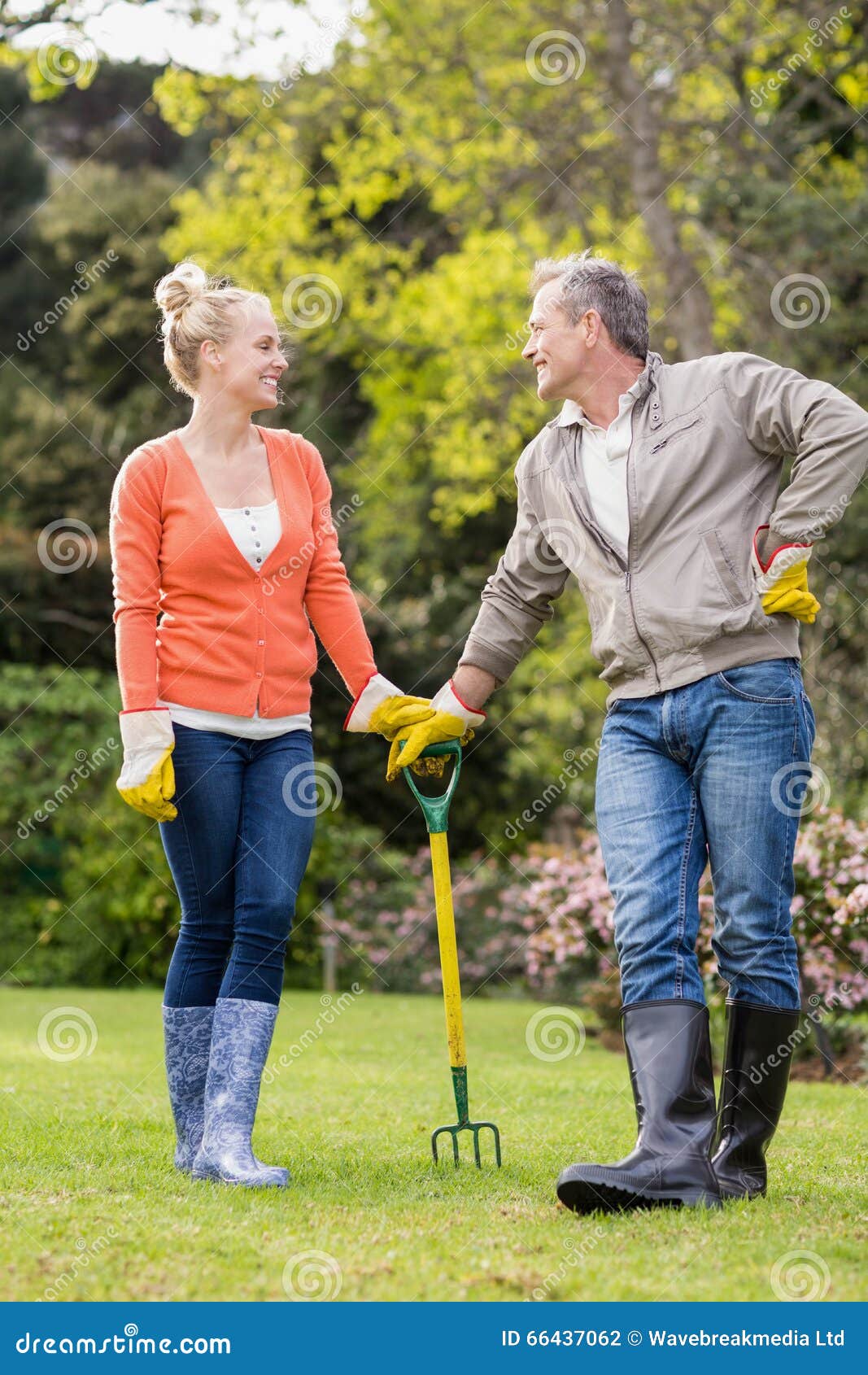 Cute couple gardening stock photo. Image of female, garden - 66437062