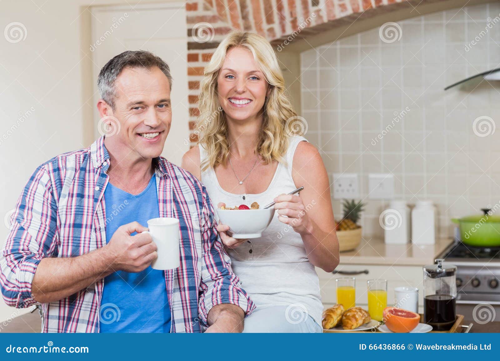 Cute Couple Having Breakfast Stock Photo - Image of caucasian, kitchen ...