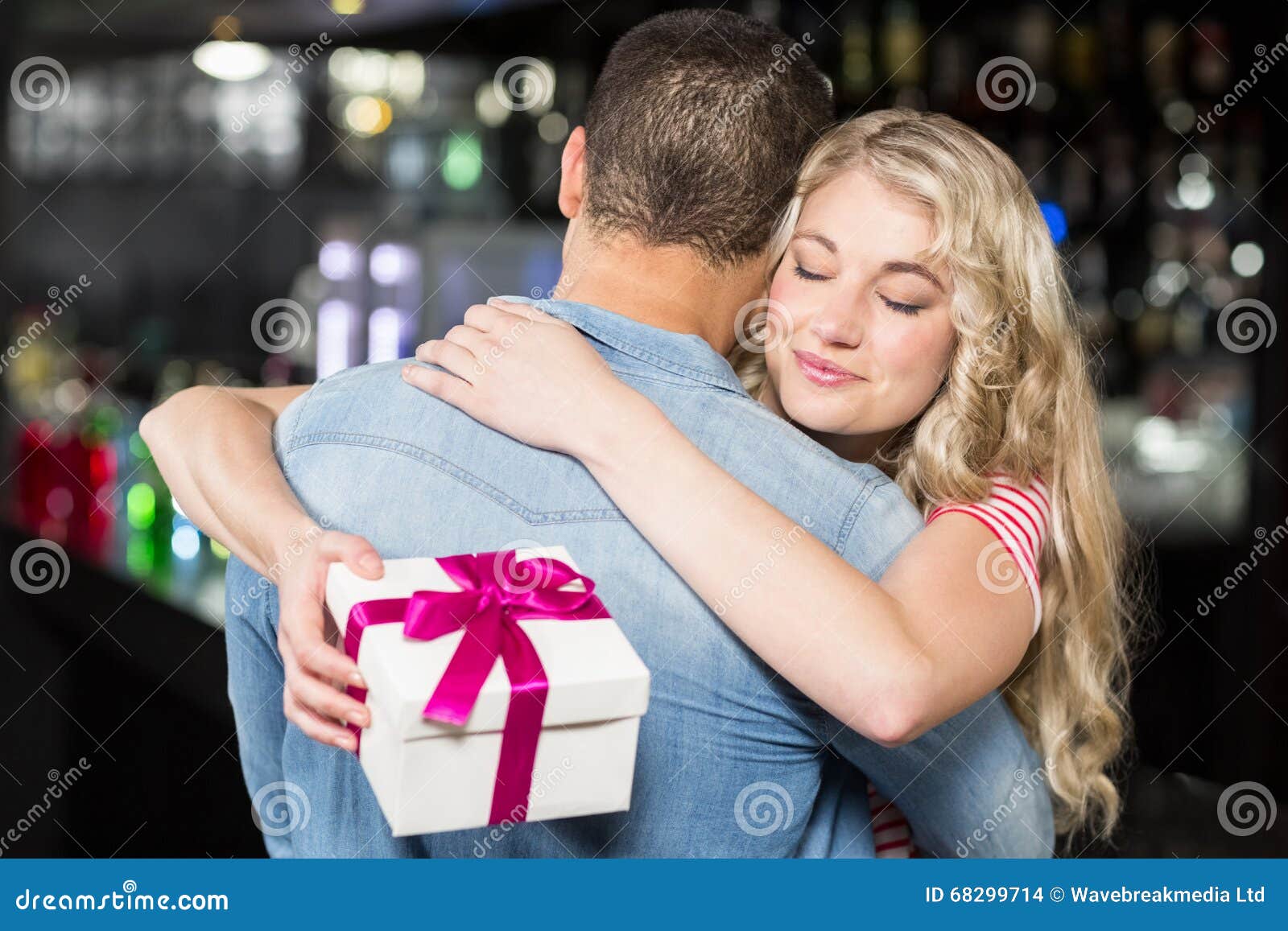 Cute Couple Hugging Having a Gift Stock Photo - Image of celebrating ...