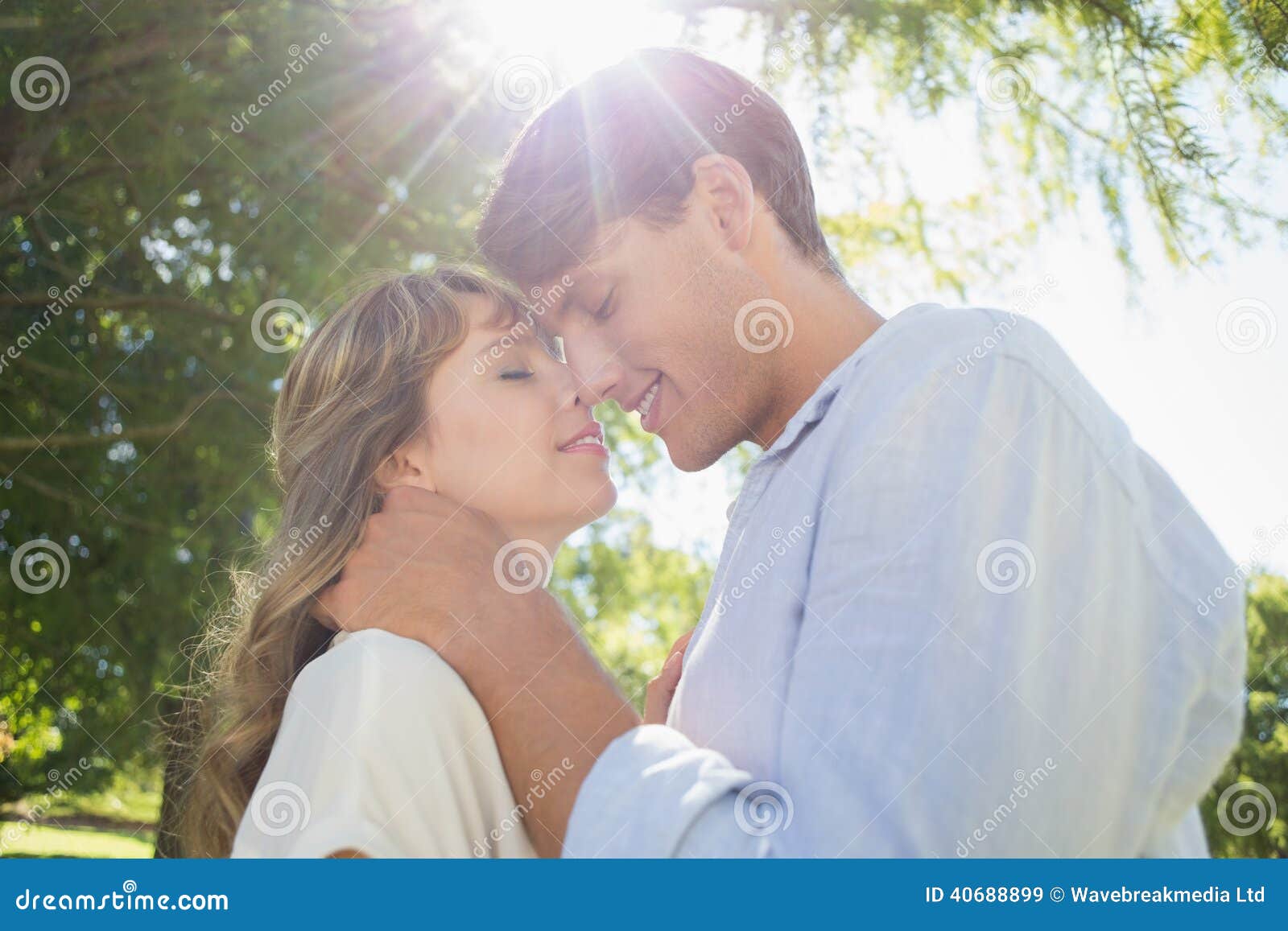 Cute Couple Hugging and Smiling in the Park Stock Image - Image of ...