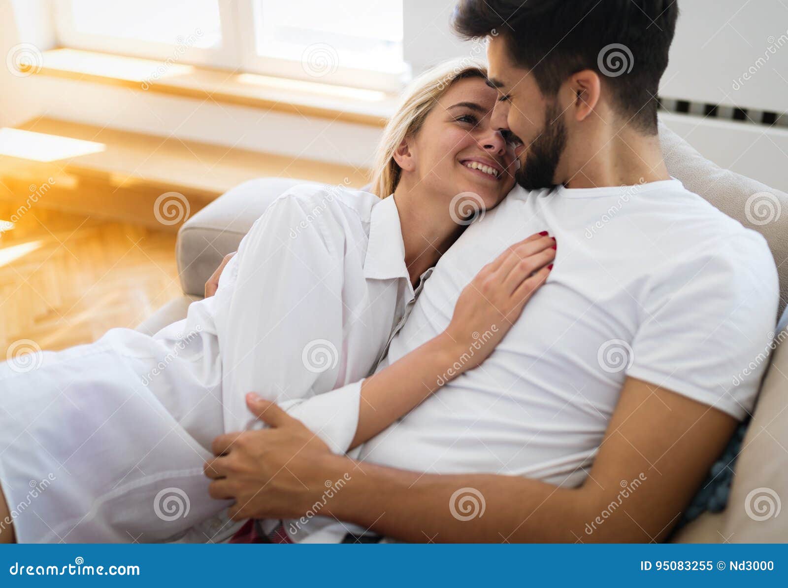 Cute Couple Hugging and Smiling in Their Home Stock Image - Image of ...