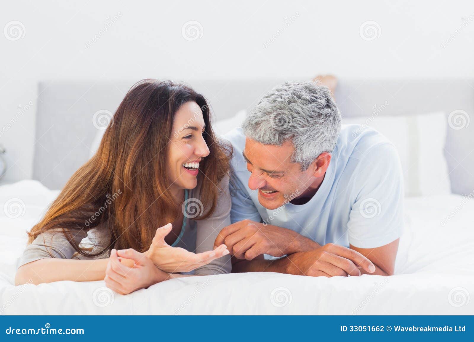 Cute Couple Lying on Bed Talking Together Stock Photo - Image of adult ... Cute Couple Lying on Bed Talking Together Stock Photo - Image of adult ...