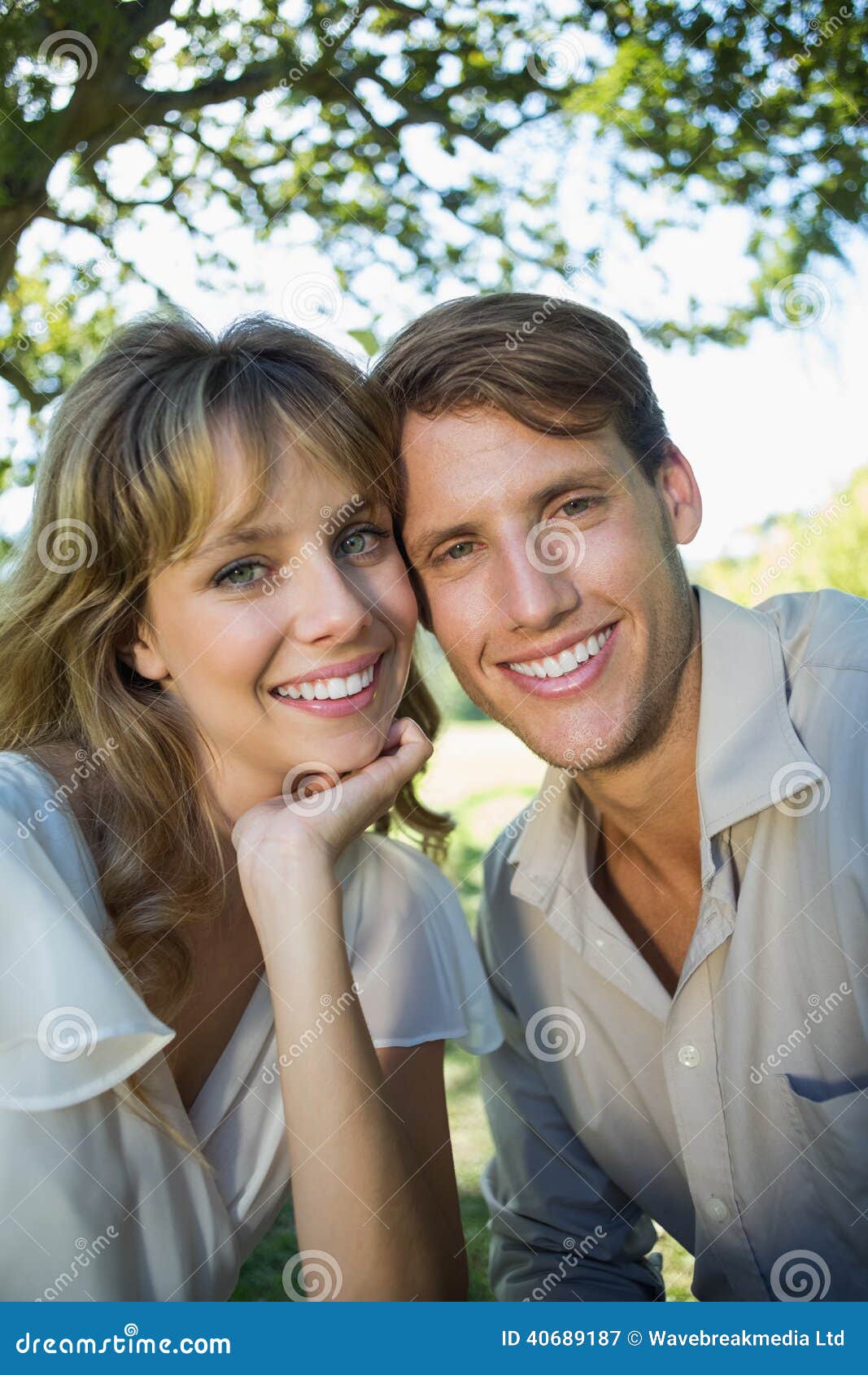 Cute Couple Sitting Outside at a Cafe Smiling at Camera Stock Image ...