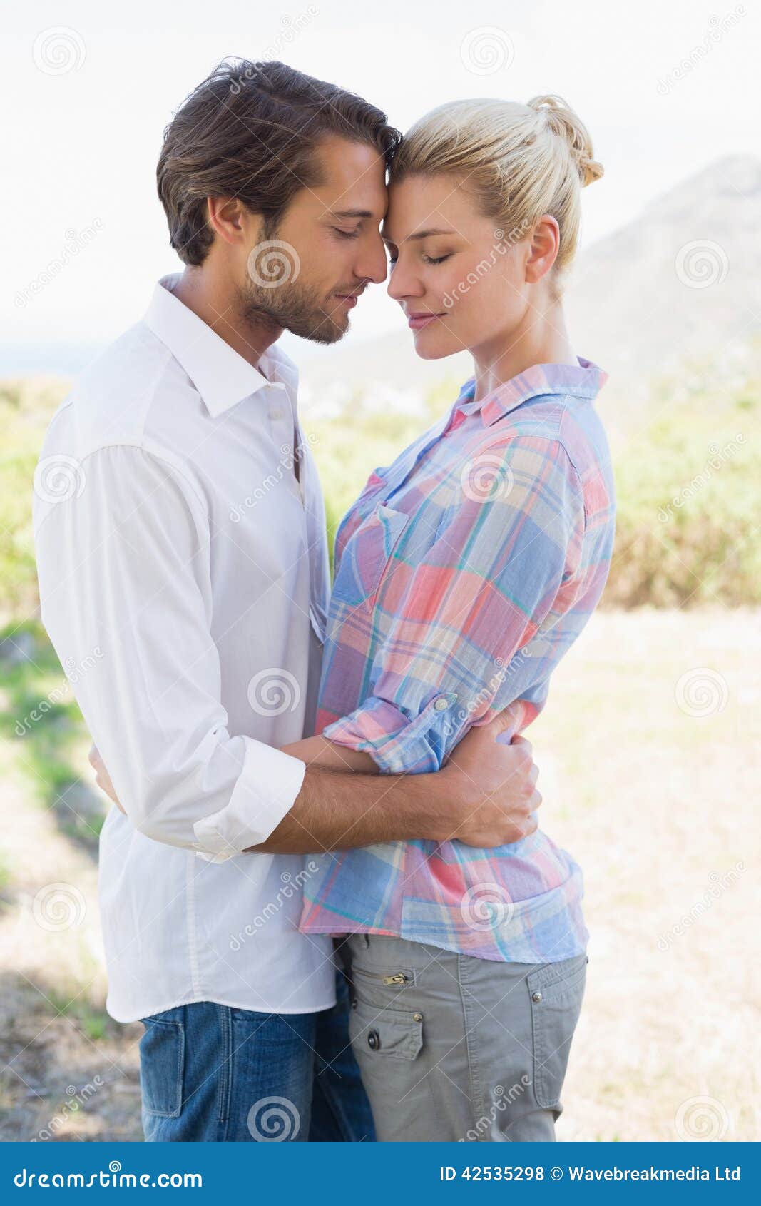 Cute Couple Standing and Hugging Stock Photo - Image of blonde ...