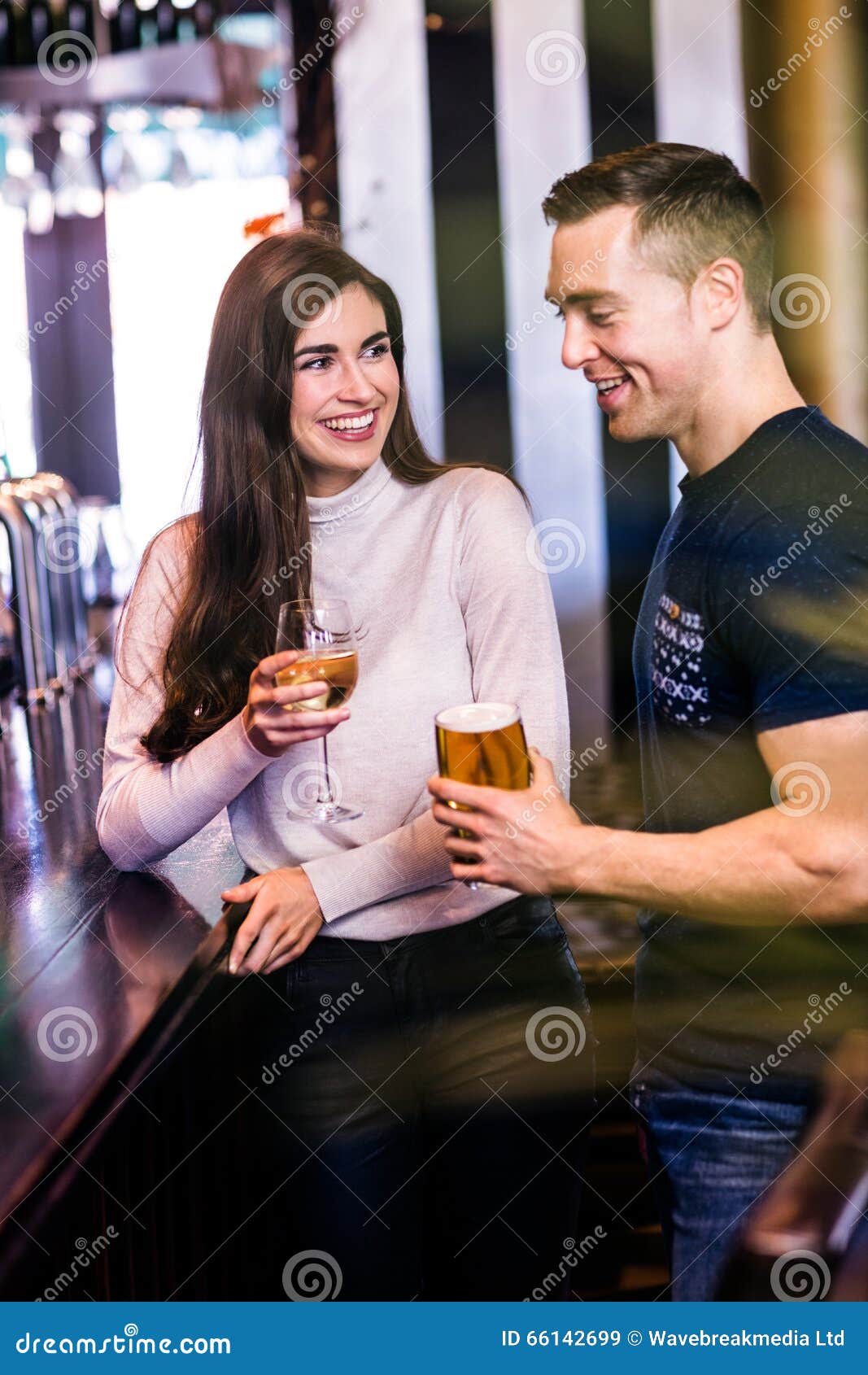 Cute Couple Talking in a Bar Stock Image - Image of food, alcohol: 66142699