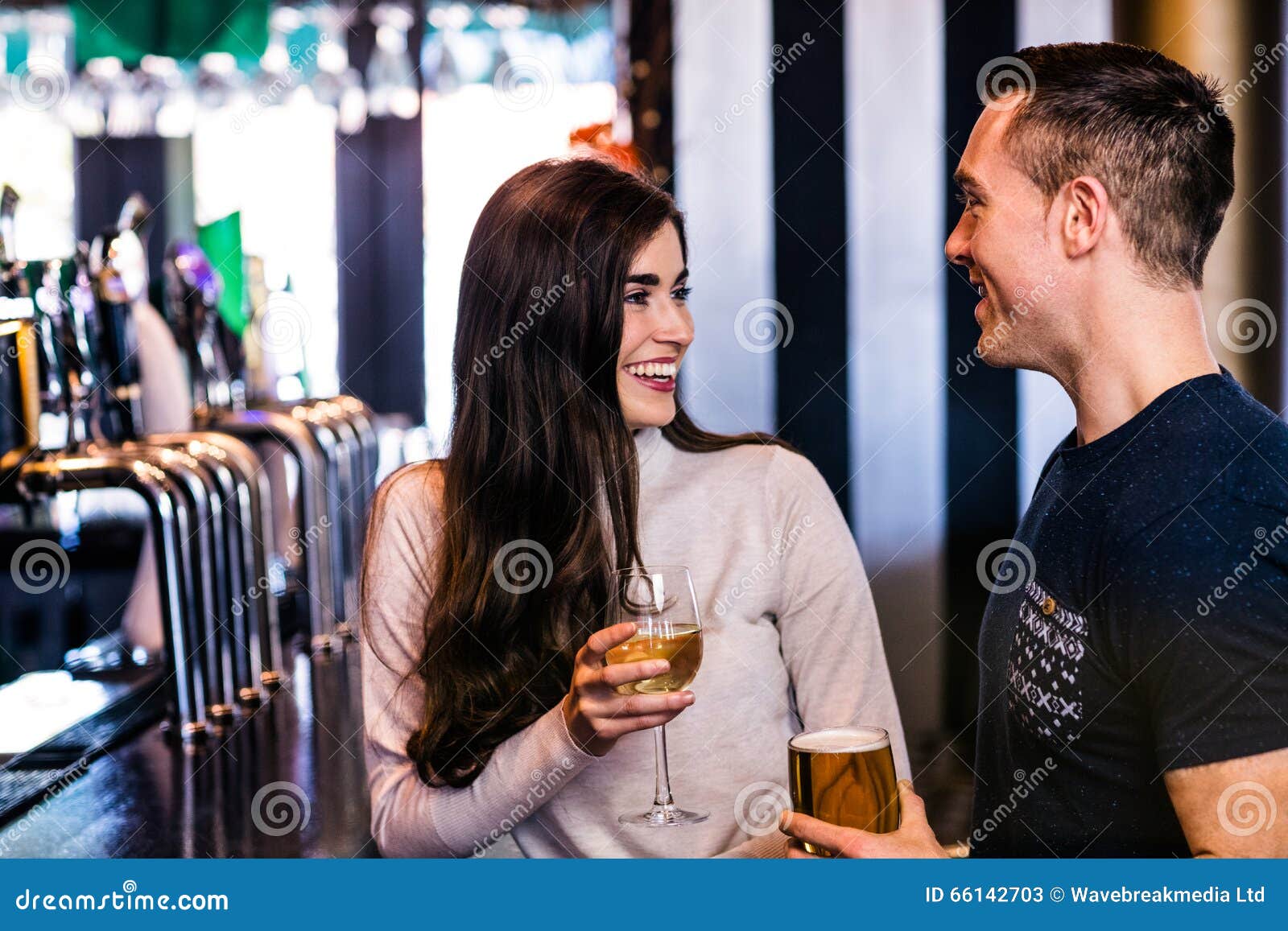 Cute Couple Talking in a Bar Stock Image - Image of female, people ...