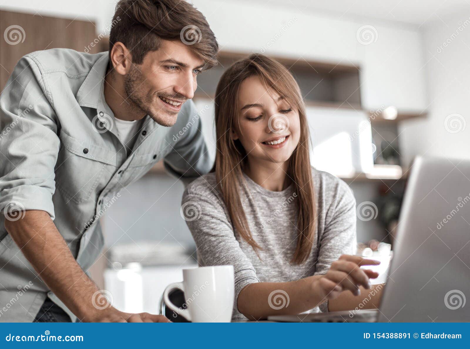 Cute Couple Using Laptop Together at Home in the Kitchen Stock Image ...