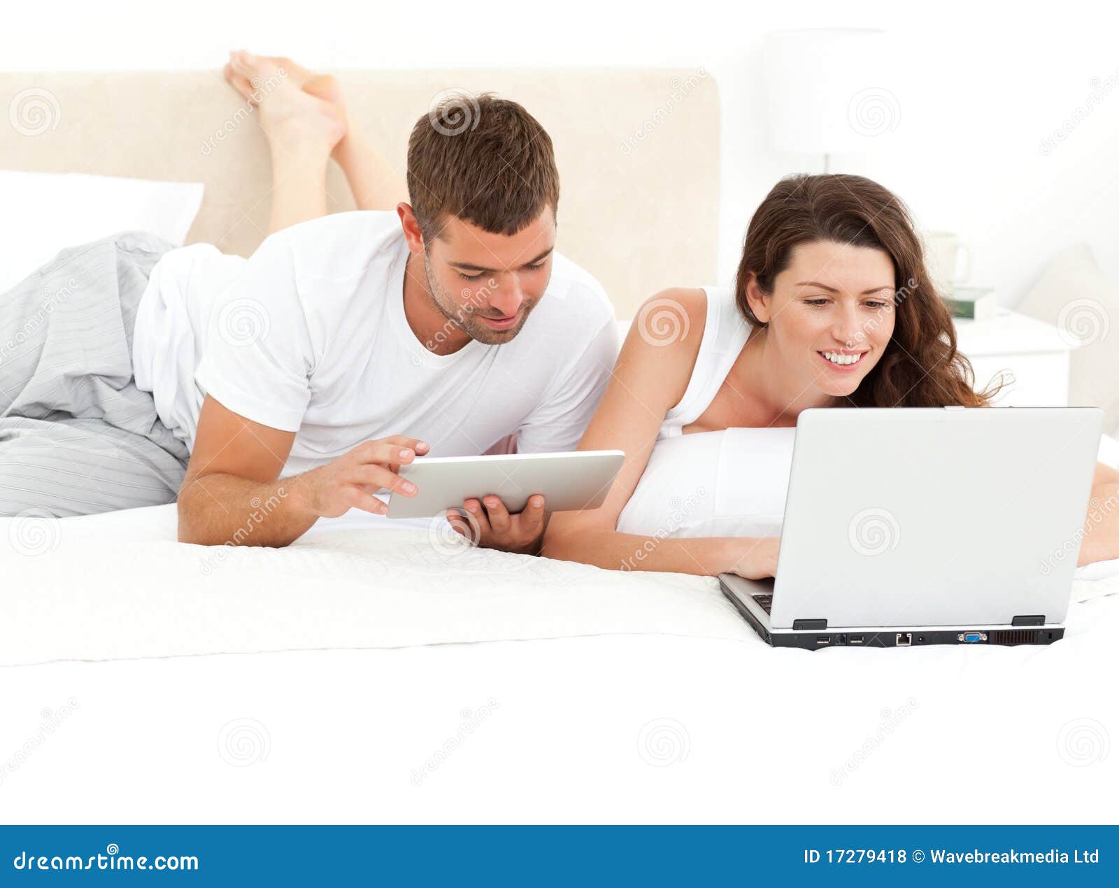 Cute Couple Working Together on Their Laptop Stock Photo - Image of ...
