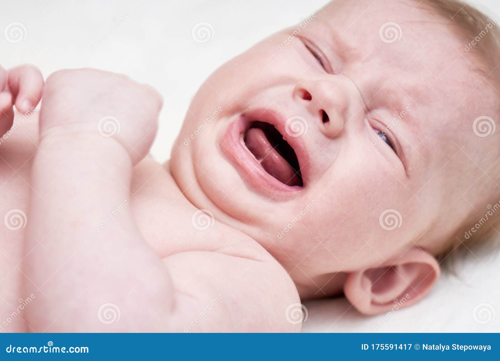 Cute Crying Baby on a Light Background Close Up. Stock Image - Image of ...