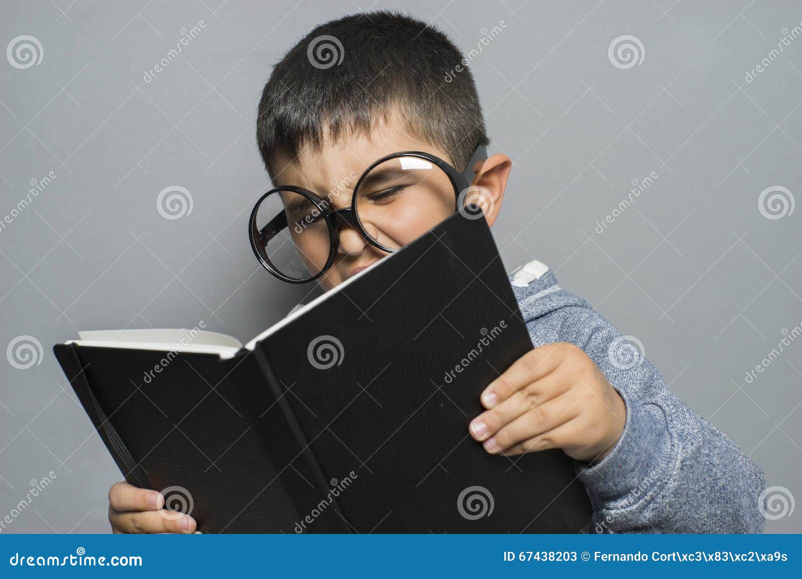Cute Dark-haired Young Student Reading a Funny Book, Reading and Stock ...